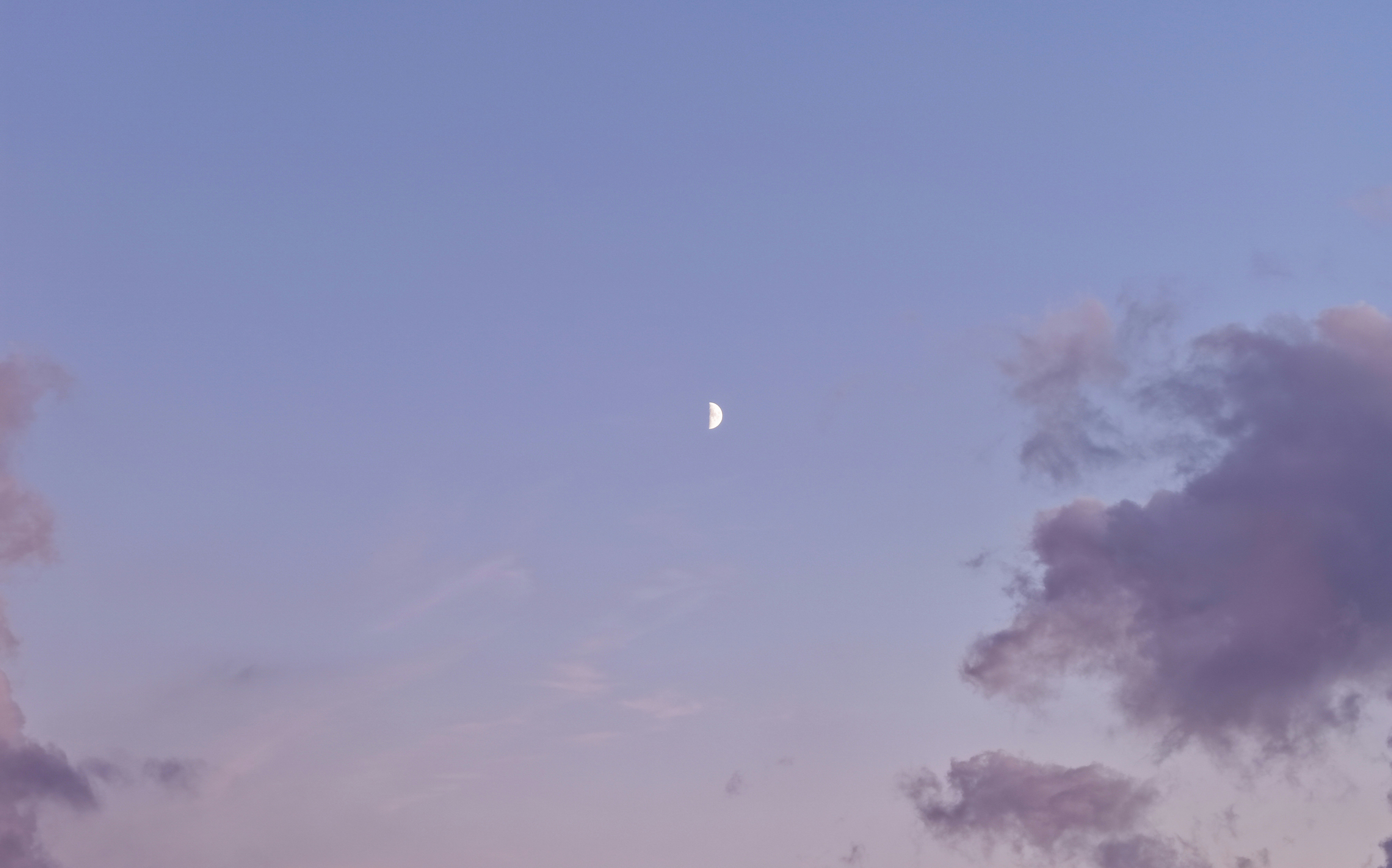 Moonlit Aerial Vista: Pale Crescent in a Velvet Sky