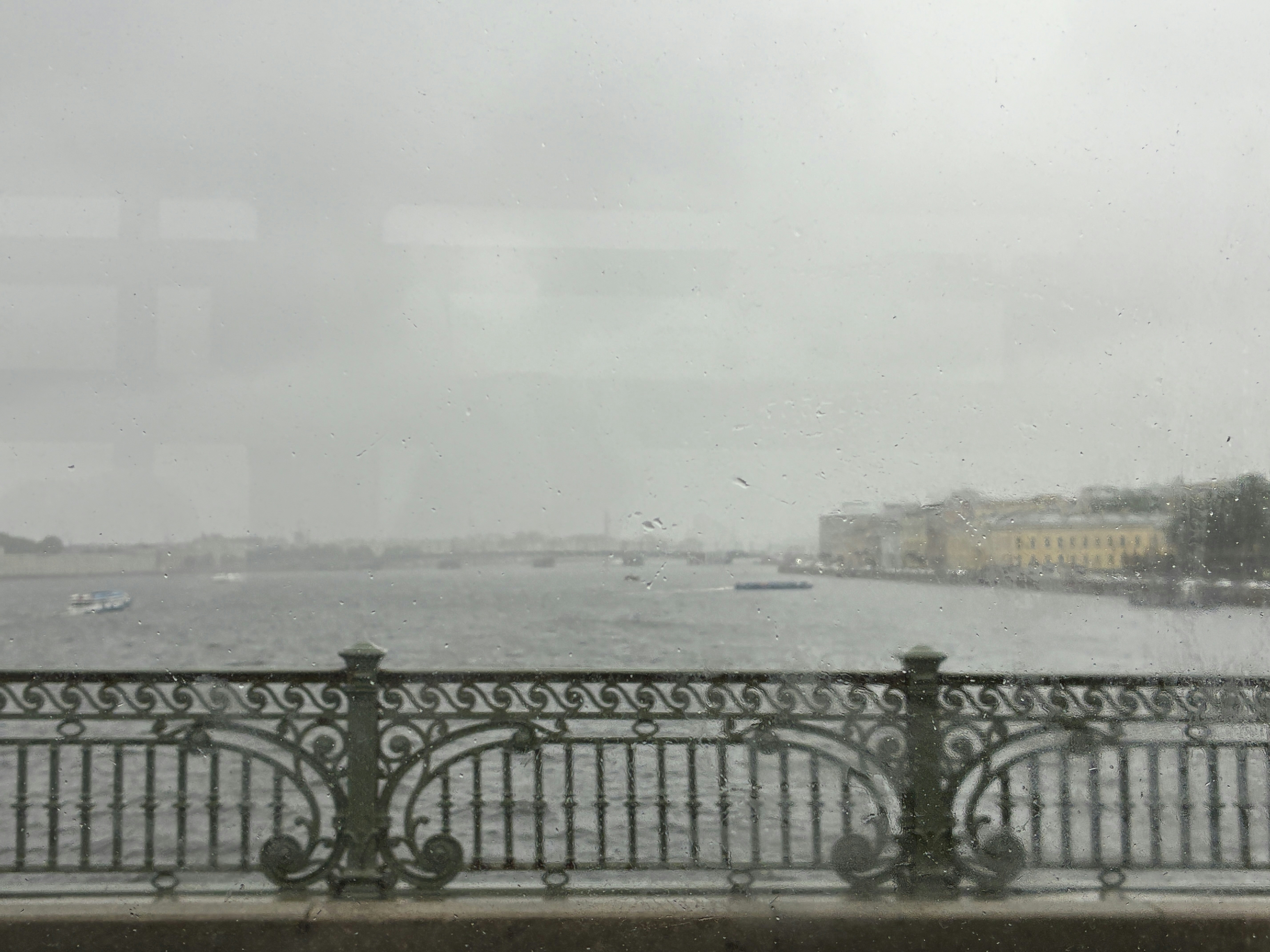Rain-Blurred Riverfront: Ironwork in Soft Overcast