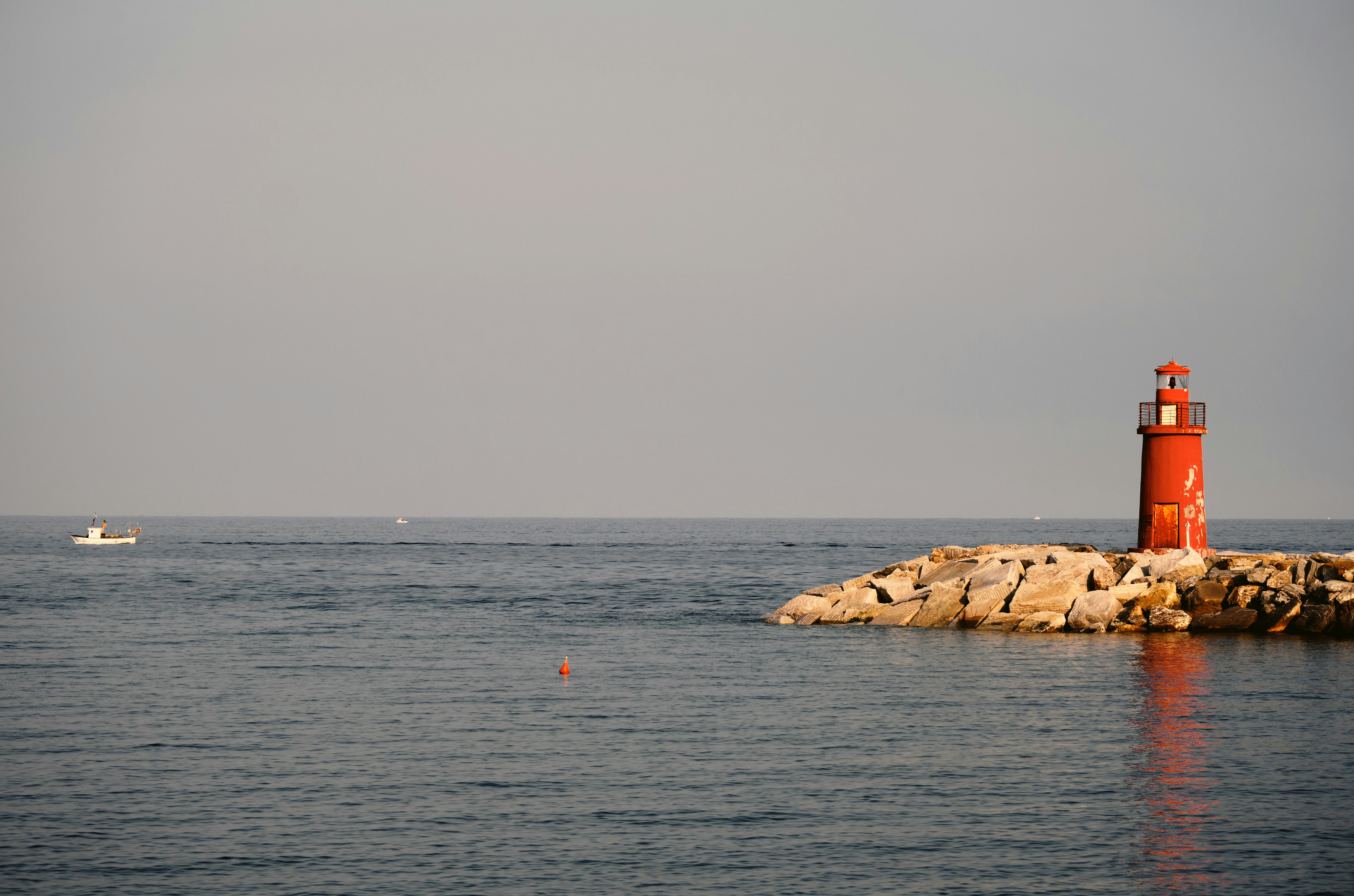 Red Lighthouse on the Quiet Breakwater