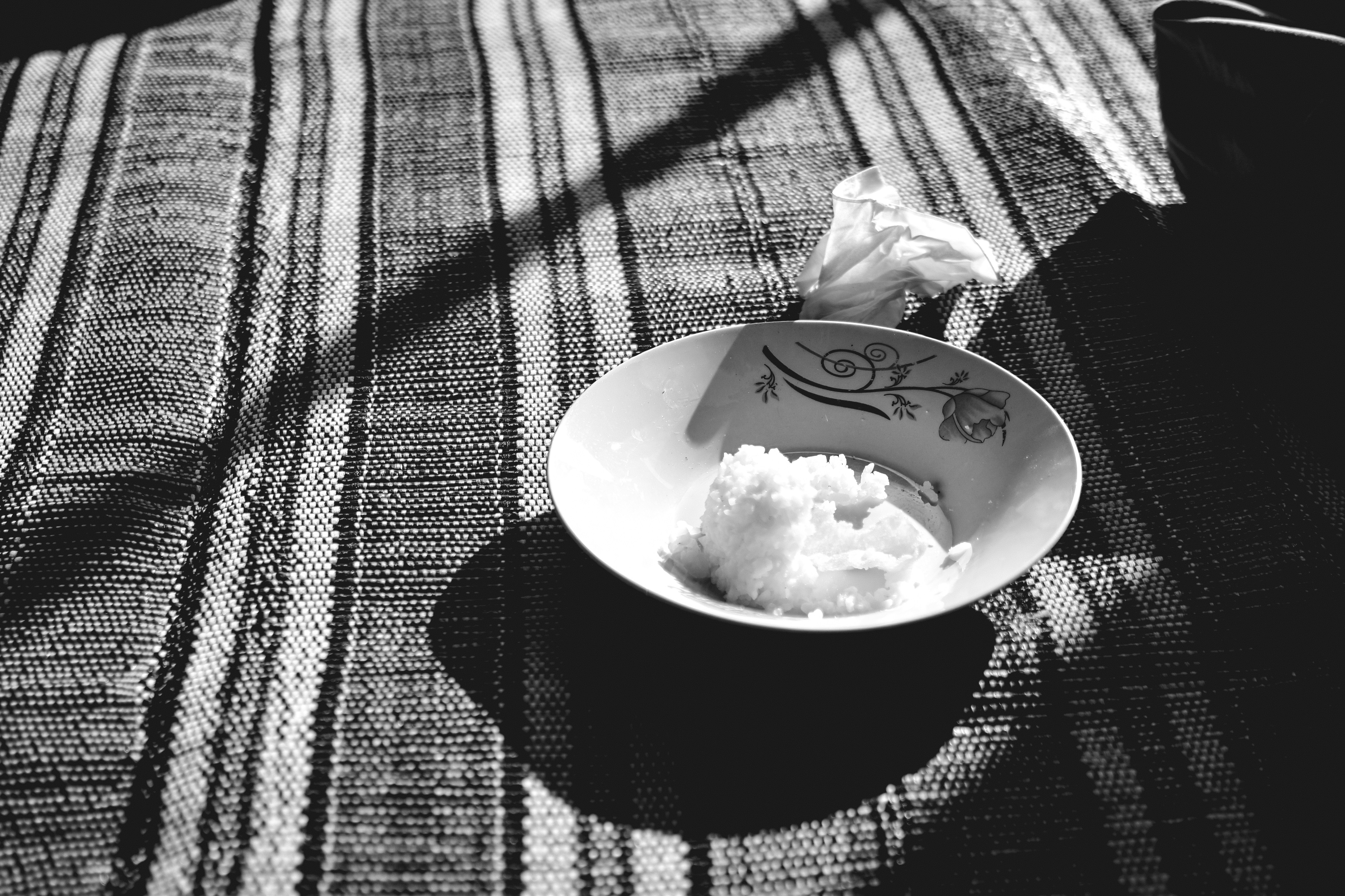 Rice in Light and Shadow on a Striped Table