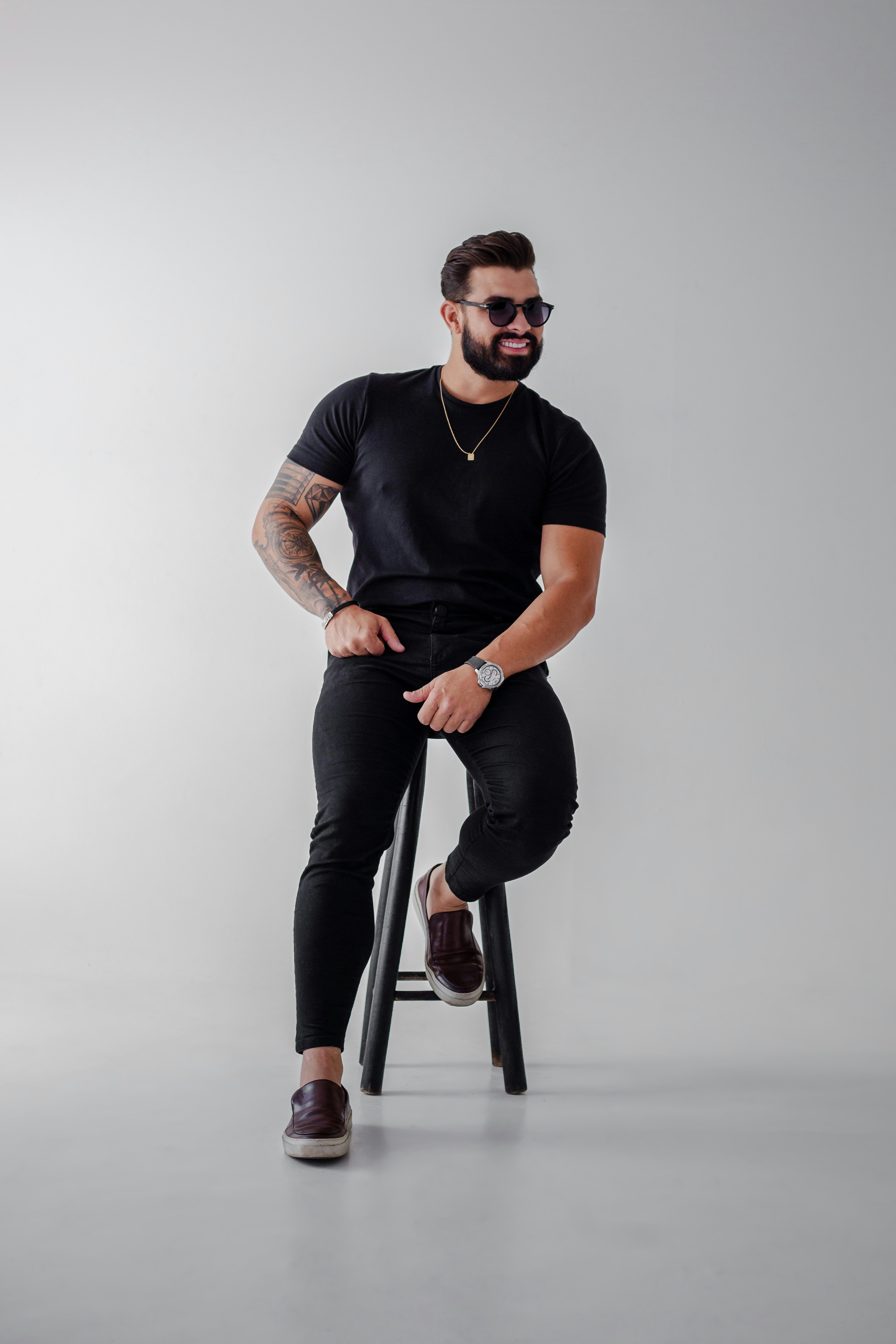 Confident Portrait: Modern Gentleman with Sunglasses and Tattoos
