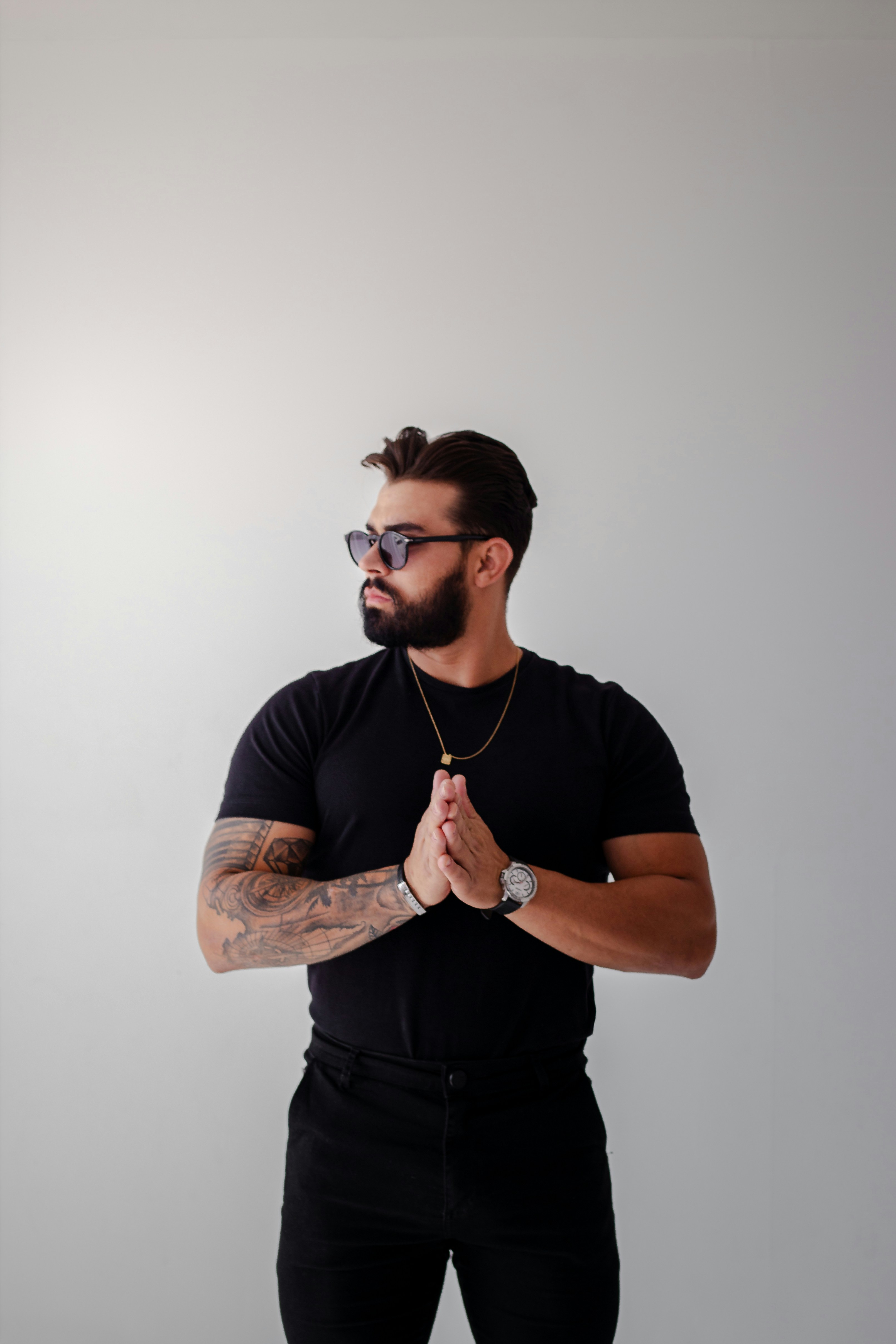 Pose of Confidence: A Tattooed Moment in Simple Light