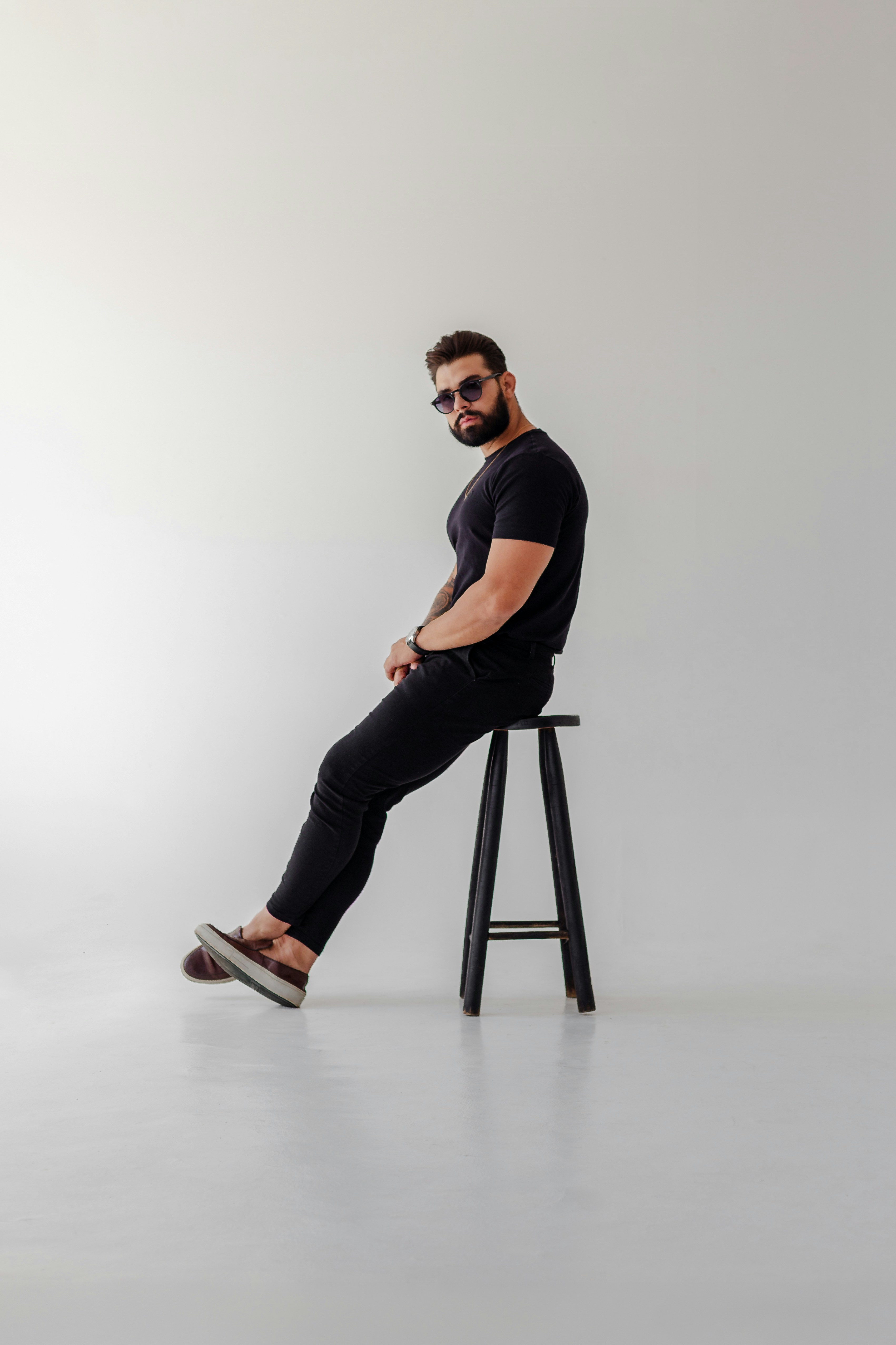 Sleek Stillness: A Quiet Moment on the Stool