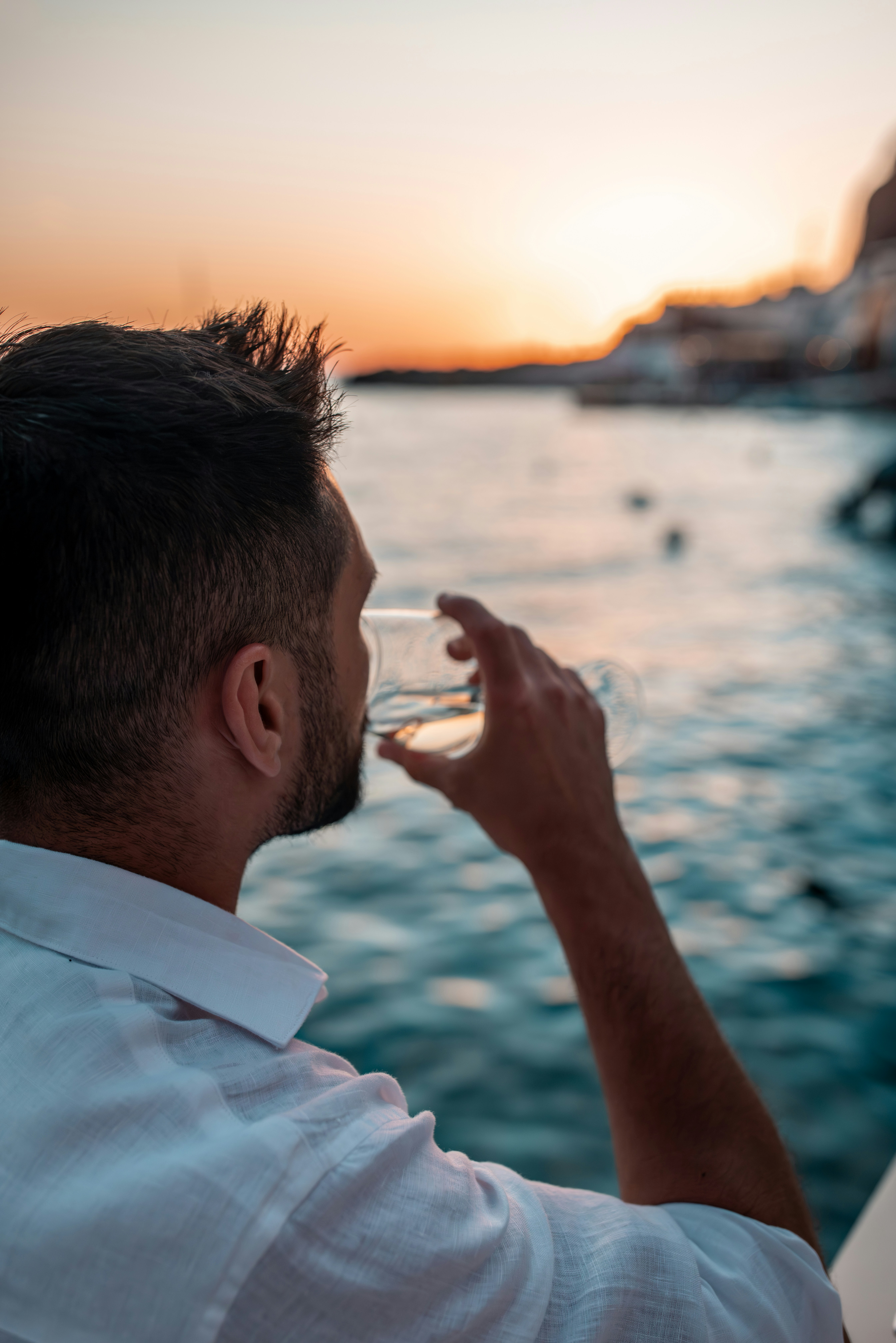 Sunset Toast: A Quiet Moment at the Water Edge