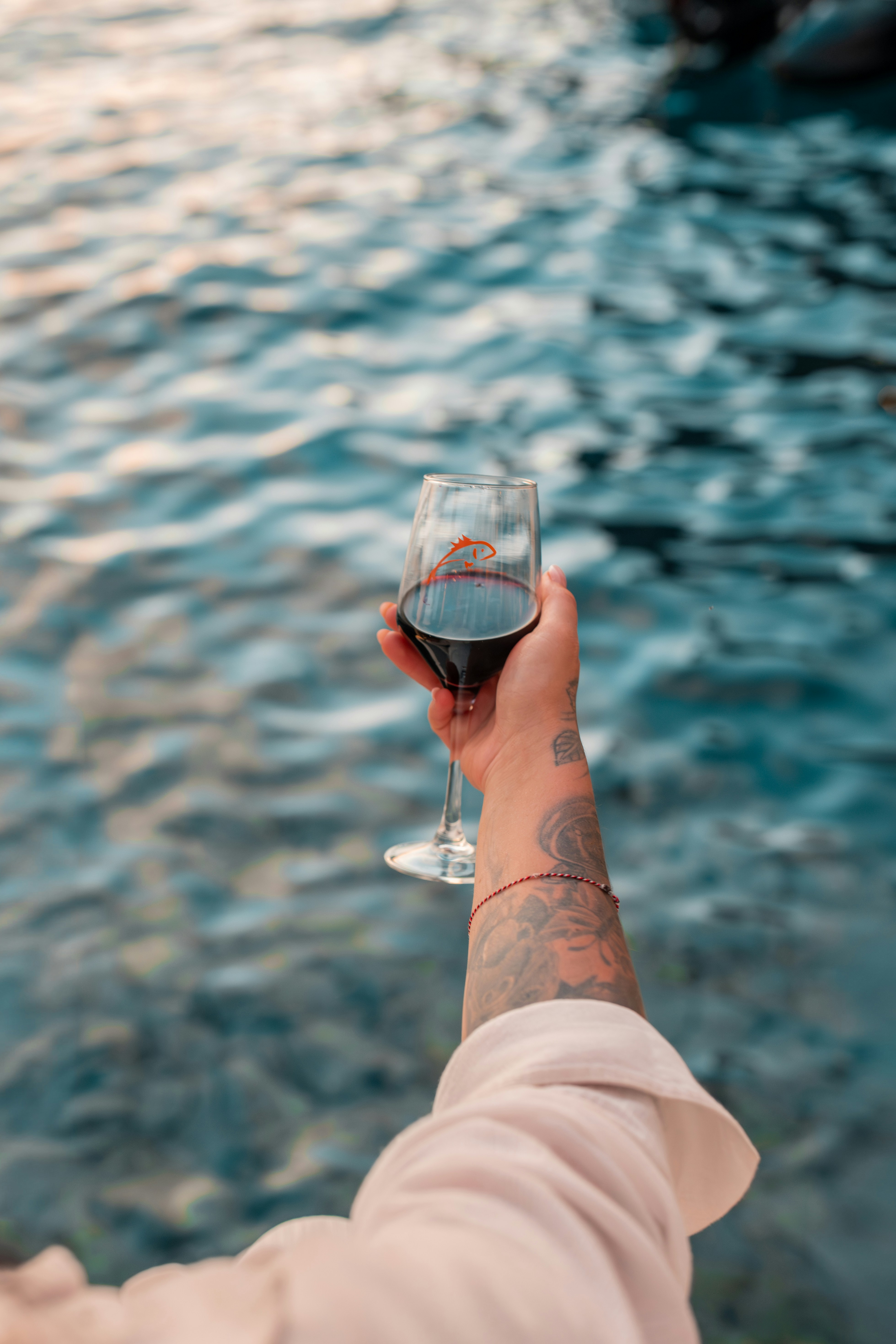 Handful of Nightfall: Red Wine Over a Seaside Wake