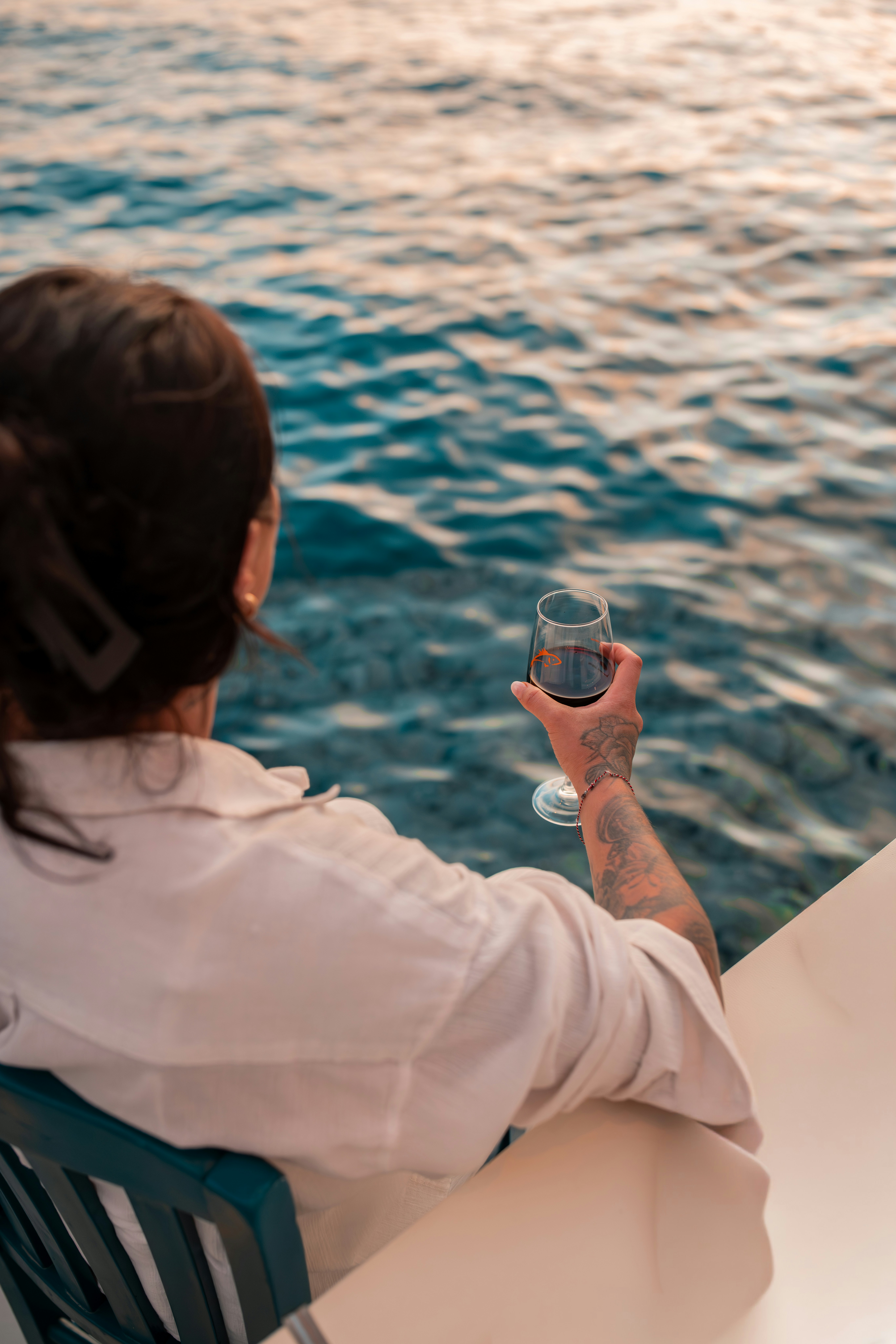 Toast by the Sea: A Quiet Moment on Deck