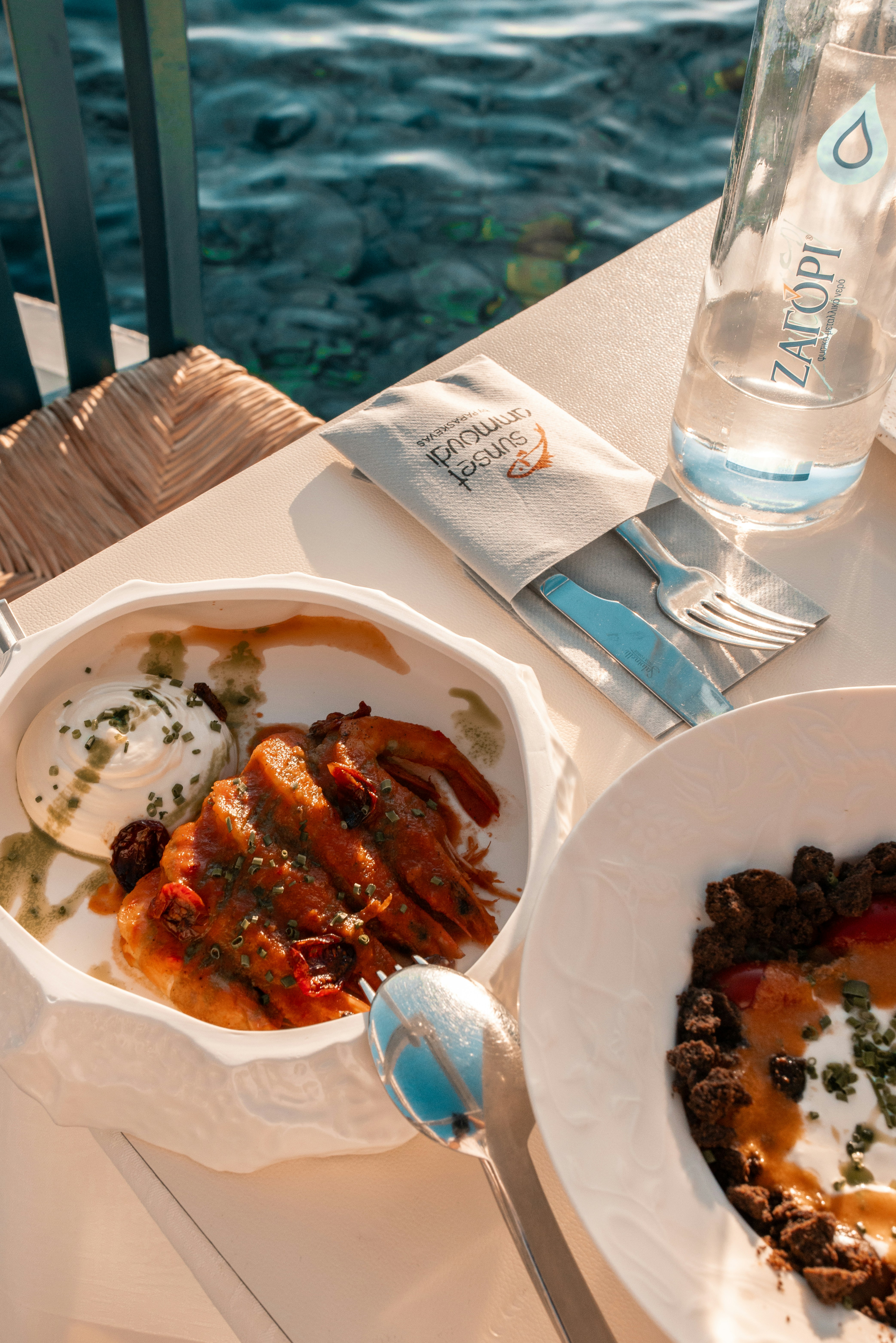 Waterfront café feast: grilled shrimp and a chocolate crumble under sunlit glass