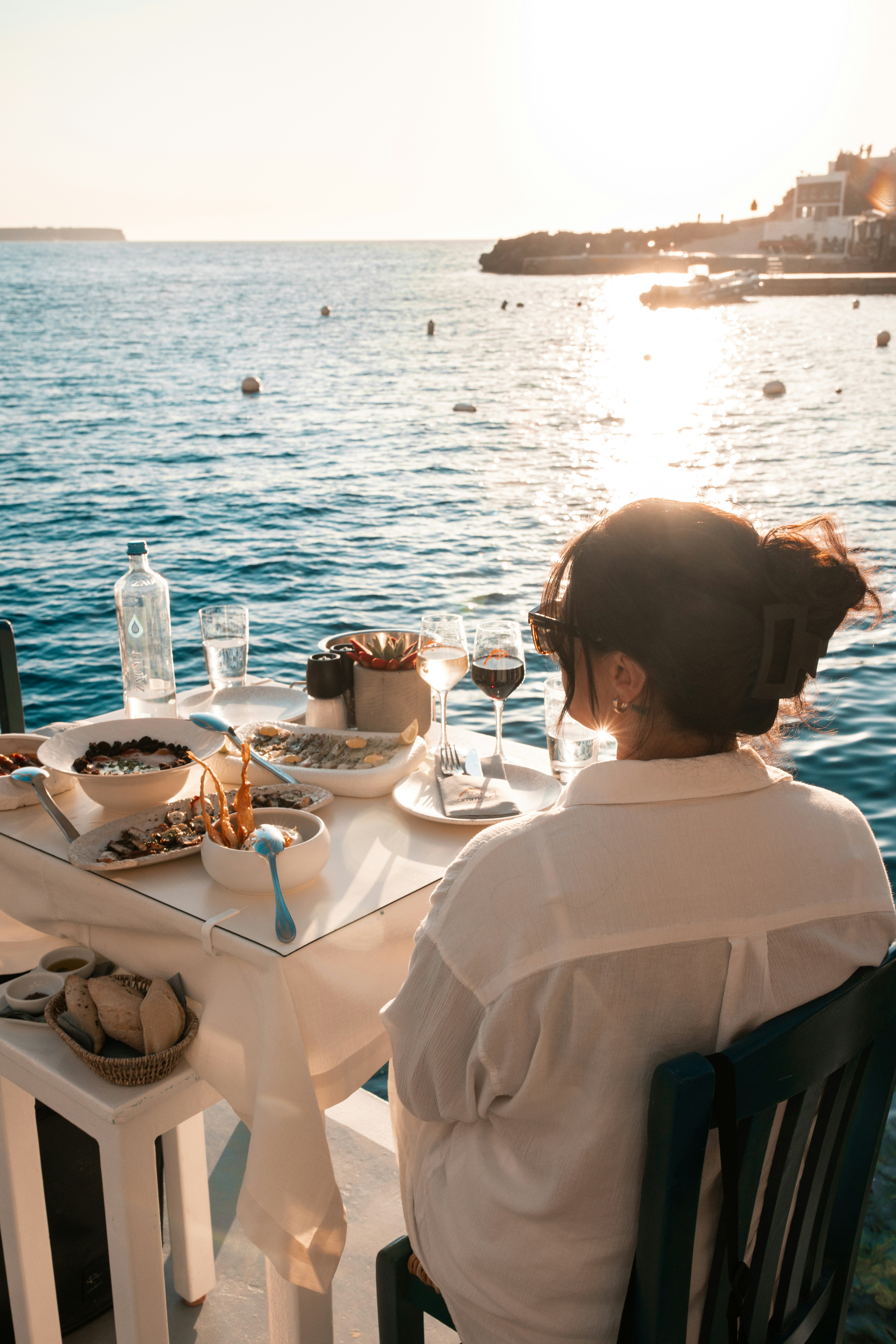 Sunlit Terrace at Sea: A Quiet Meal in the Dusk