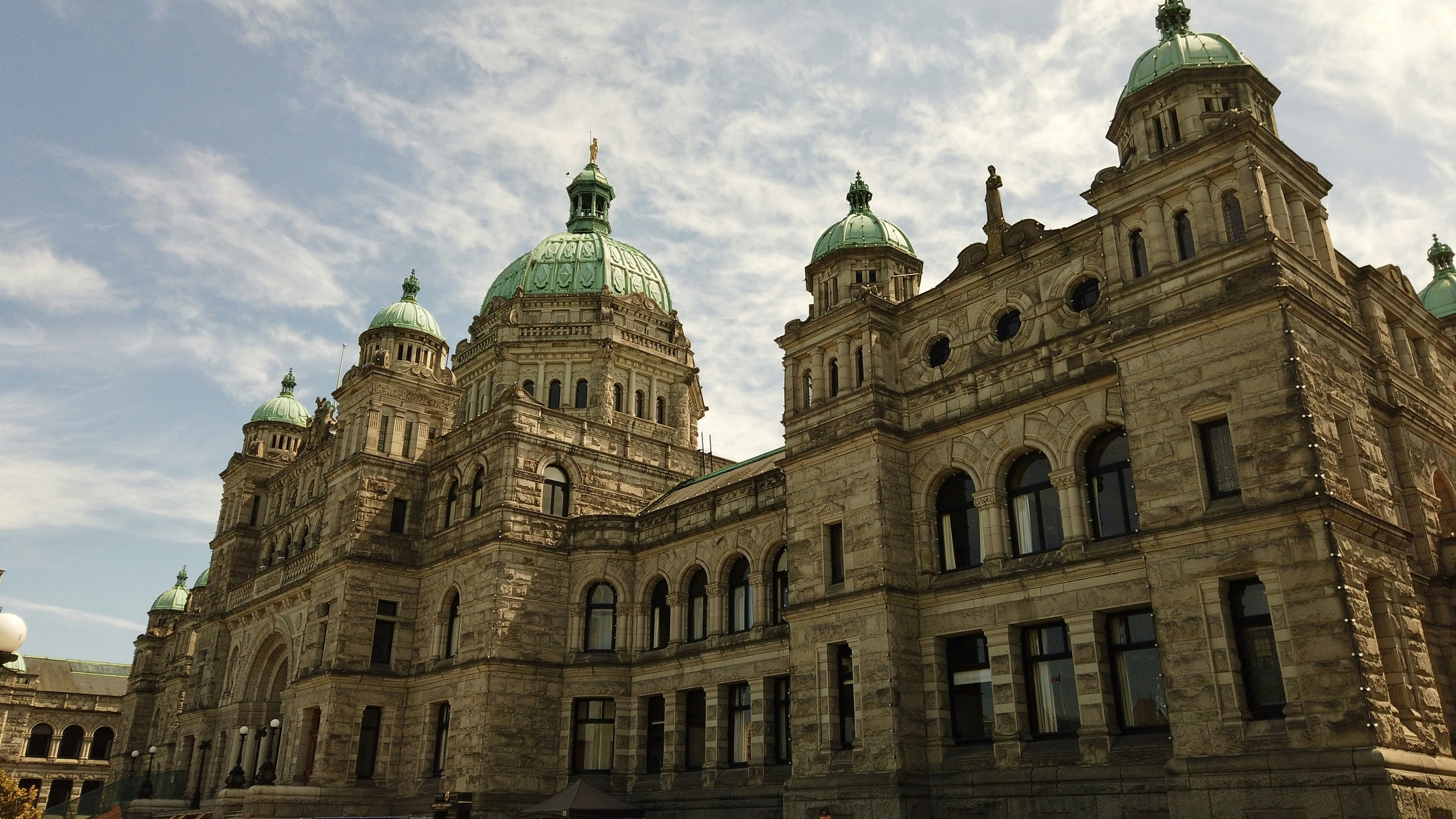 Stone Bastion: A Cathedral-Front City Hall under a Blue Sky