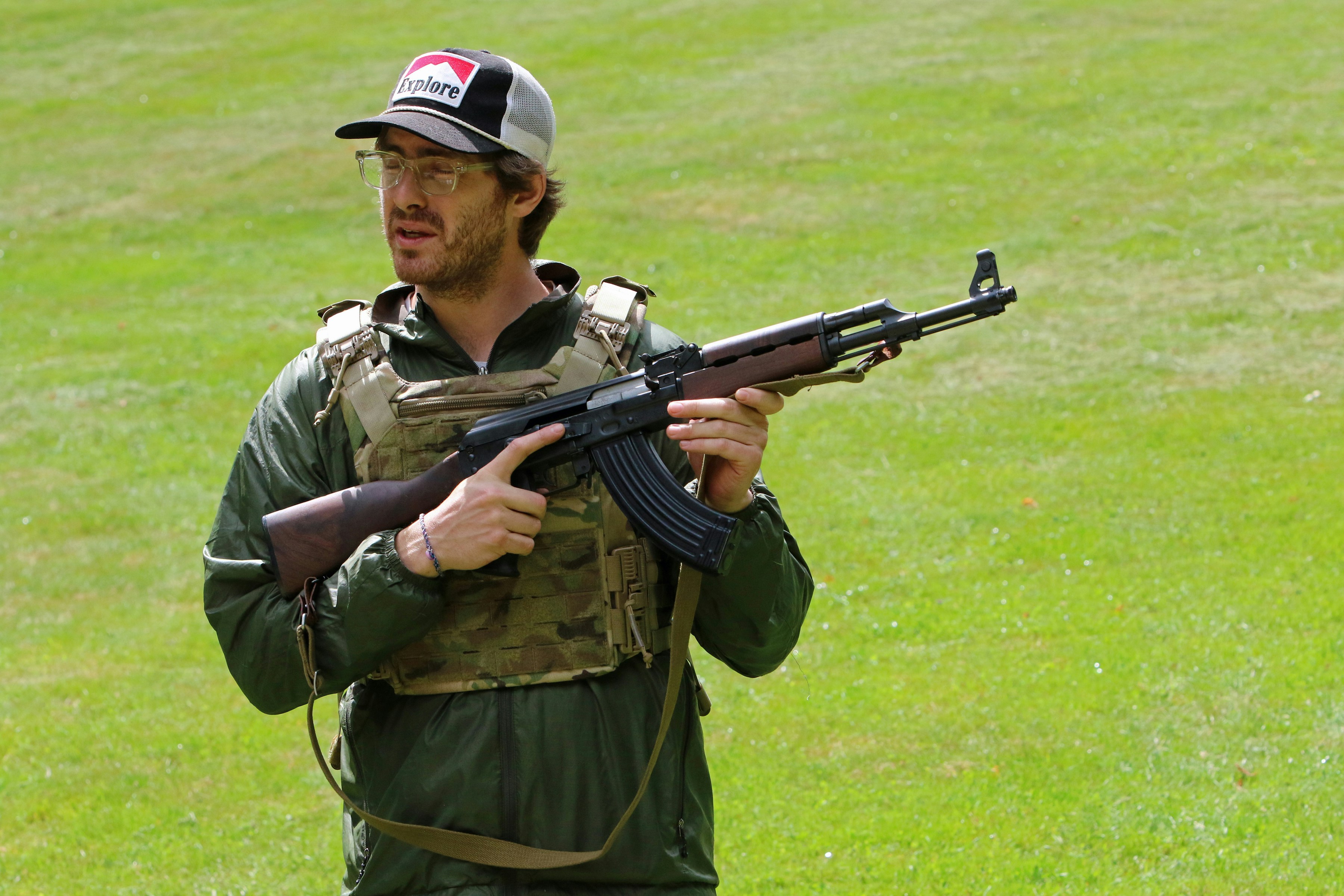 Rifleman in Field Training: Ready Stance Under Open Sky