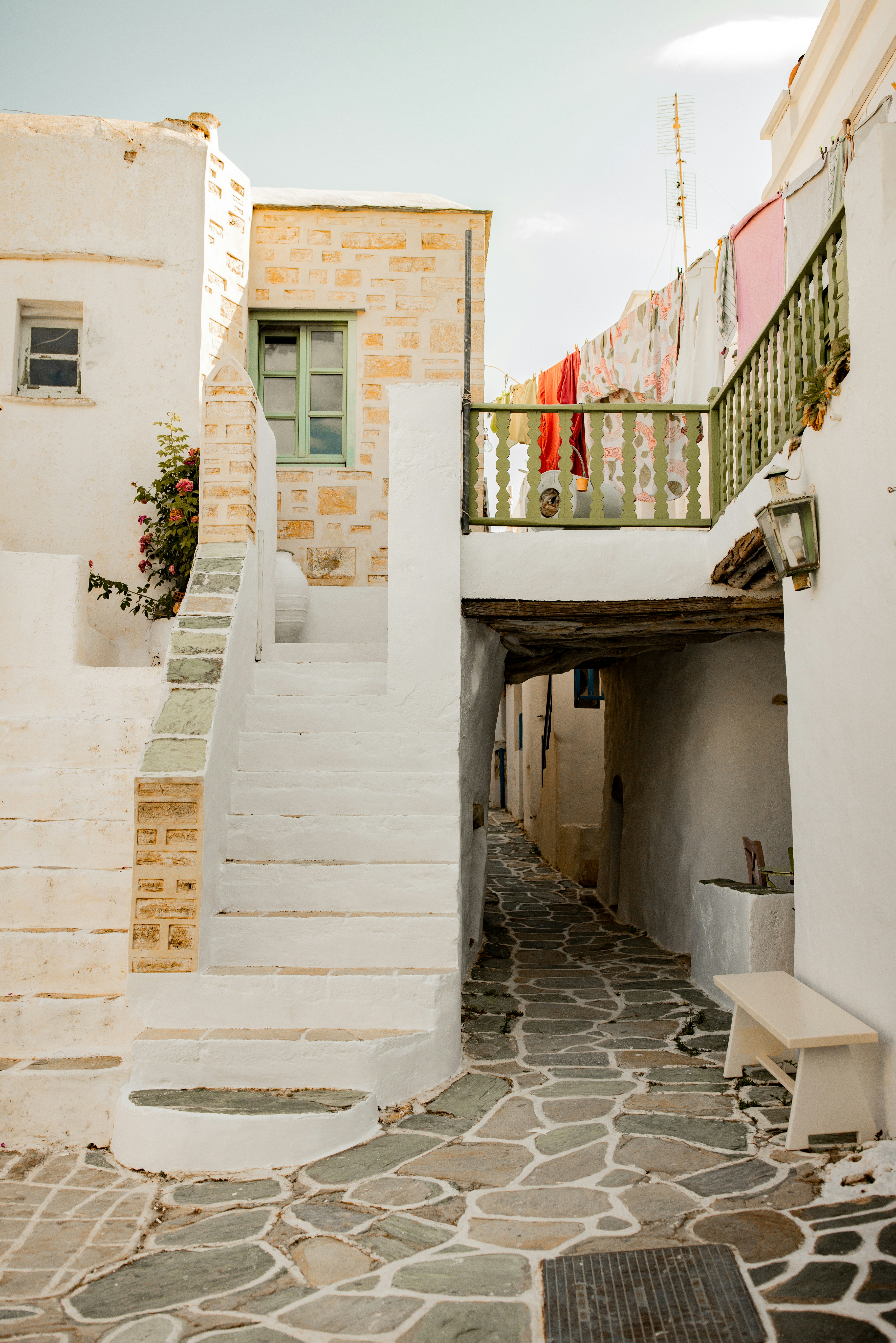Sunlit Mediterranean Staircase Between Whitewashed Walls