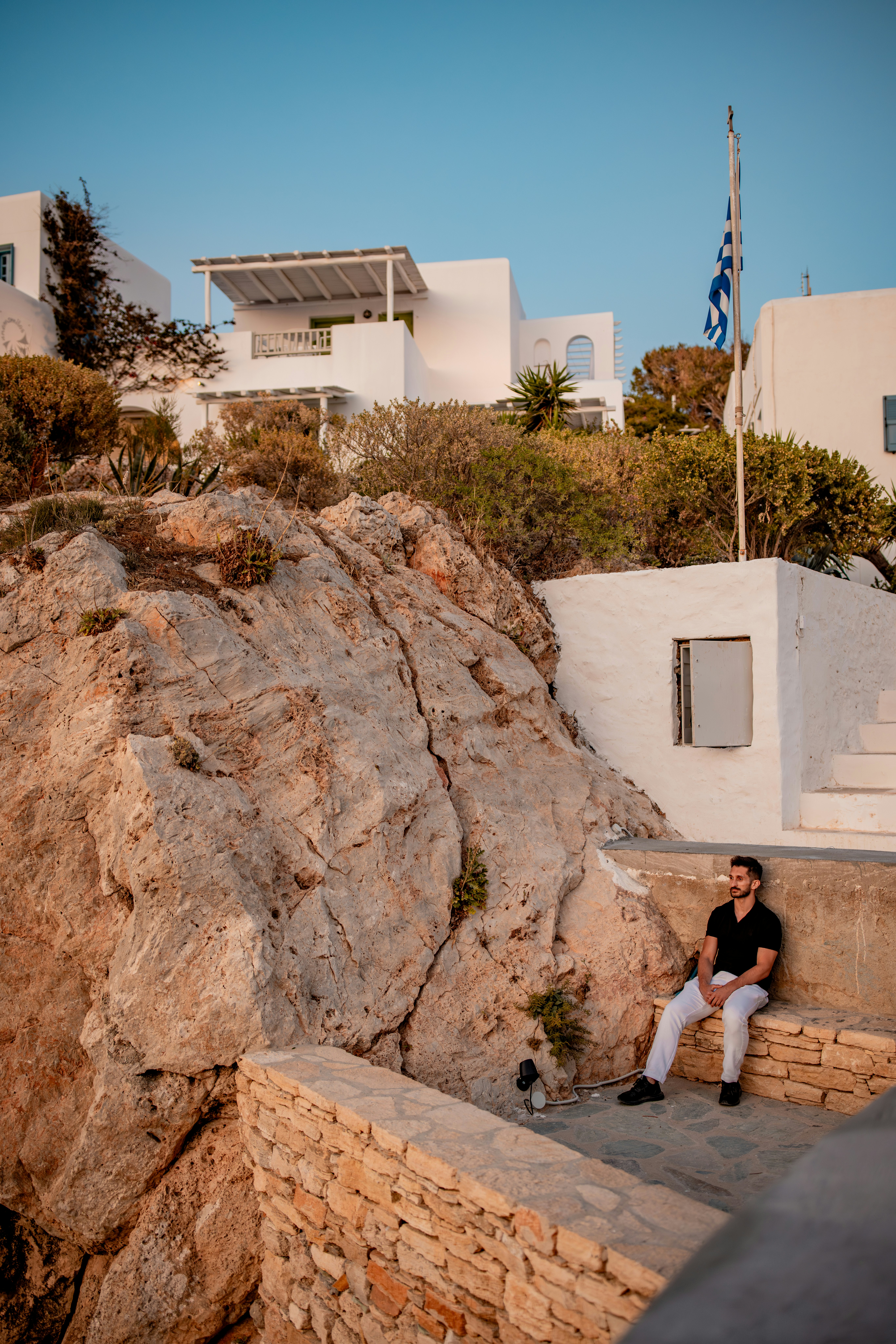 Seaside Terrace: A Quiet Pause Beneath the Greek Flag