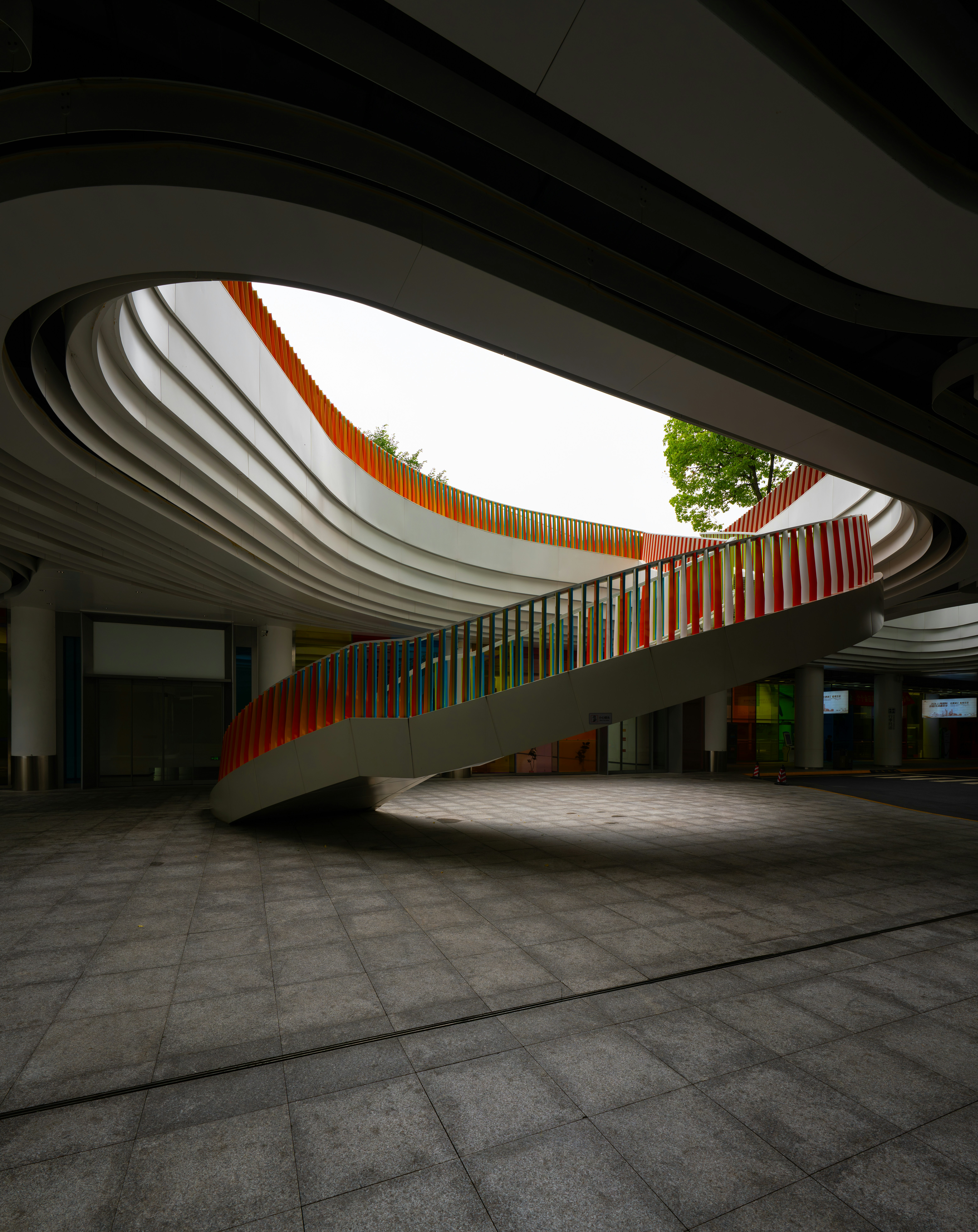 Rainbow-rimmed Spiral: Modern Architecture Under Soft Light