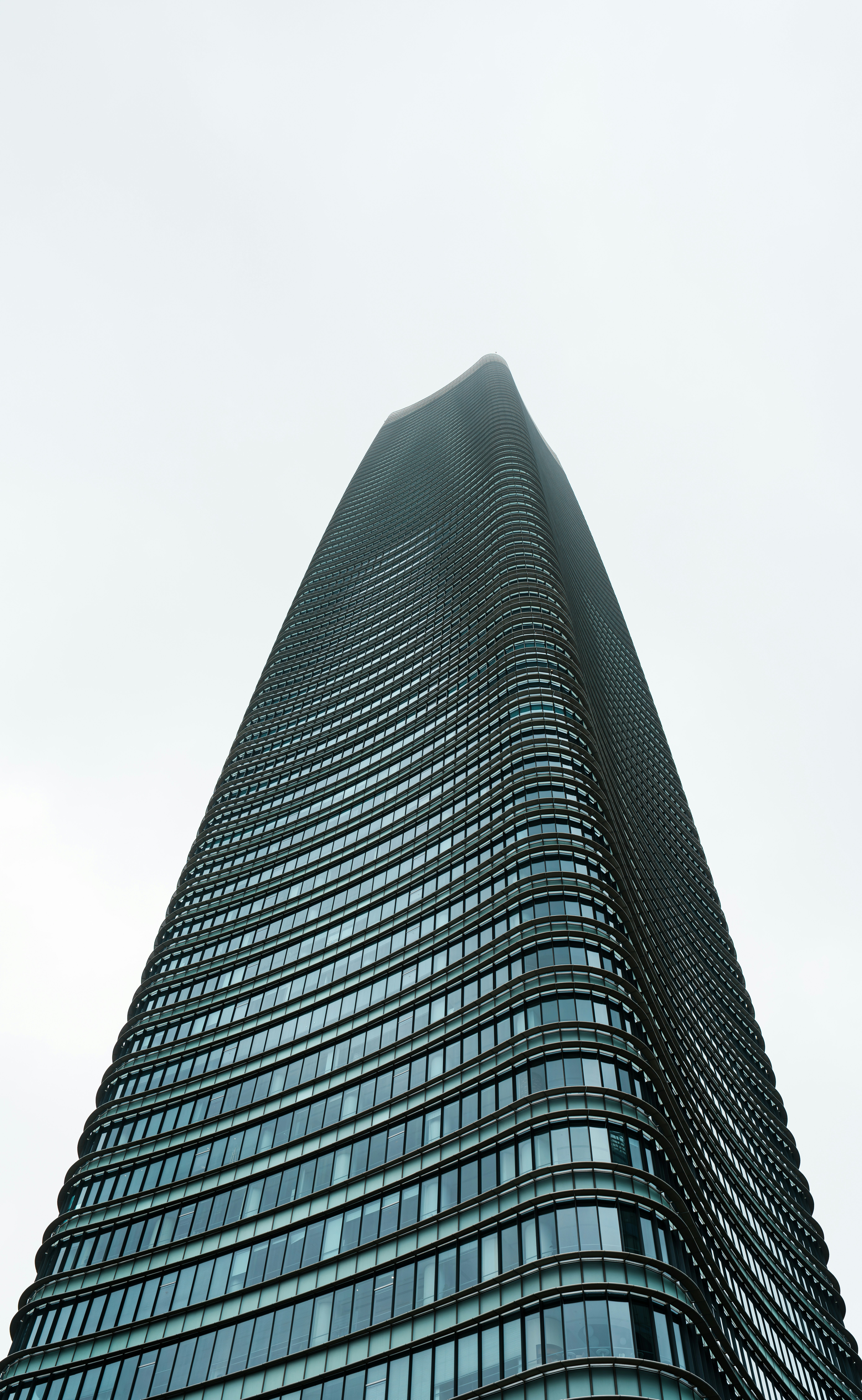 Vertical Colossus: A Towering Glass Facade Reaching the Sky