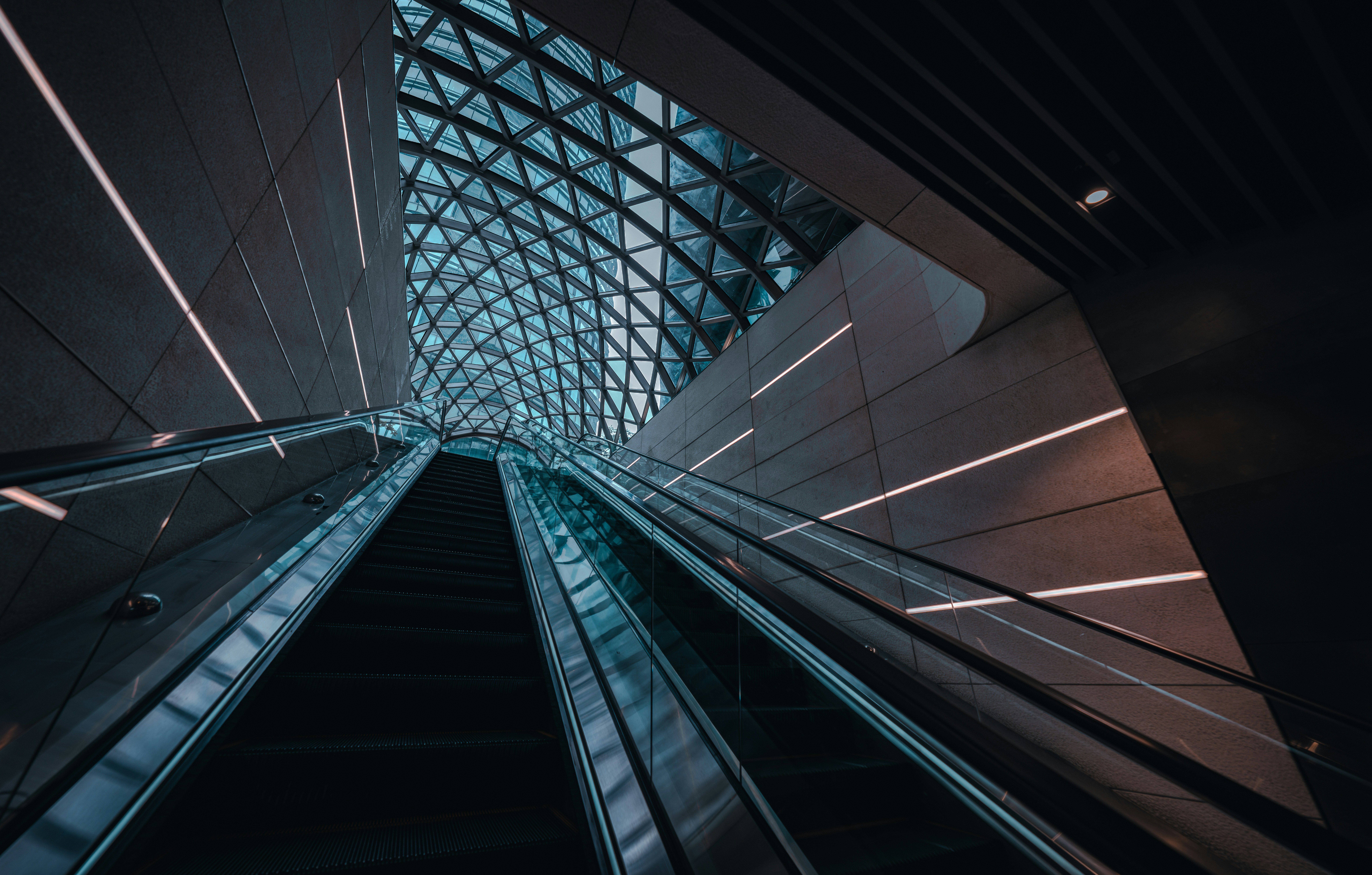 Vortex of Glass and Steel: Upward Through the Lighted Escalator