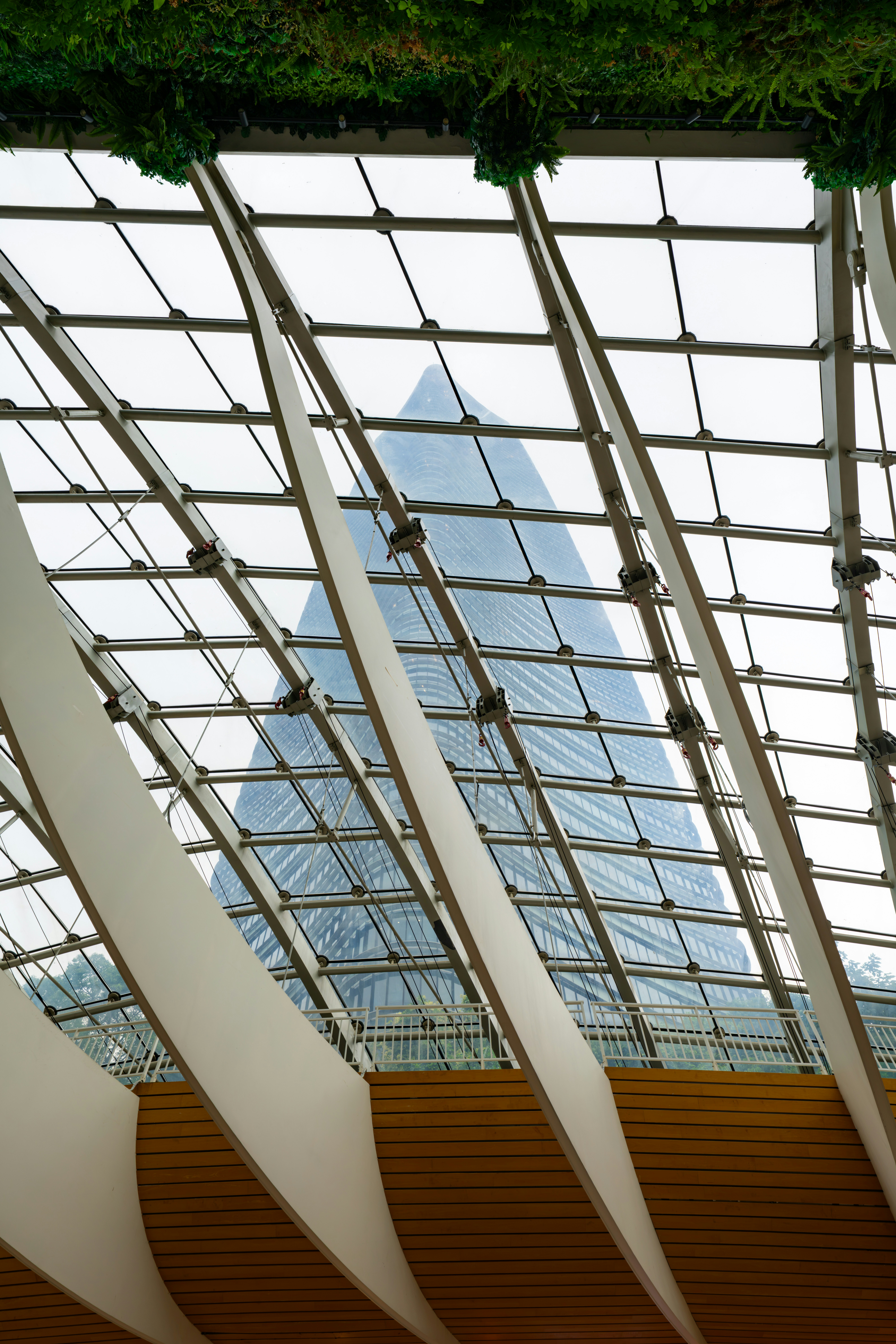 Geometric Glass and Steel: A Cathedral of Angles Framing a Distant Peak