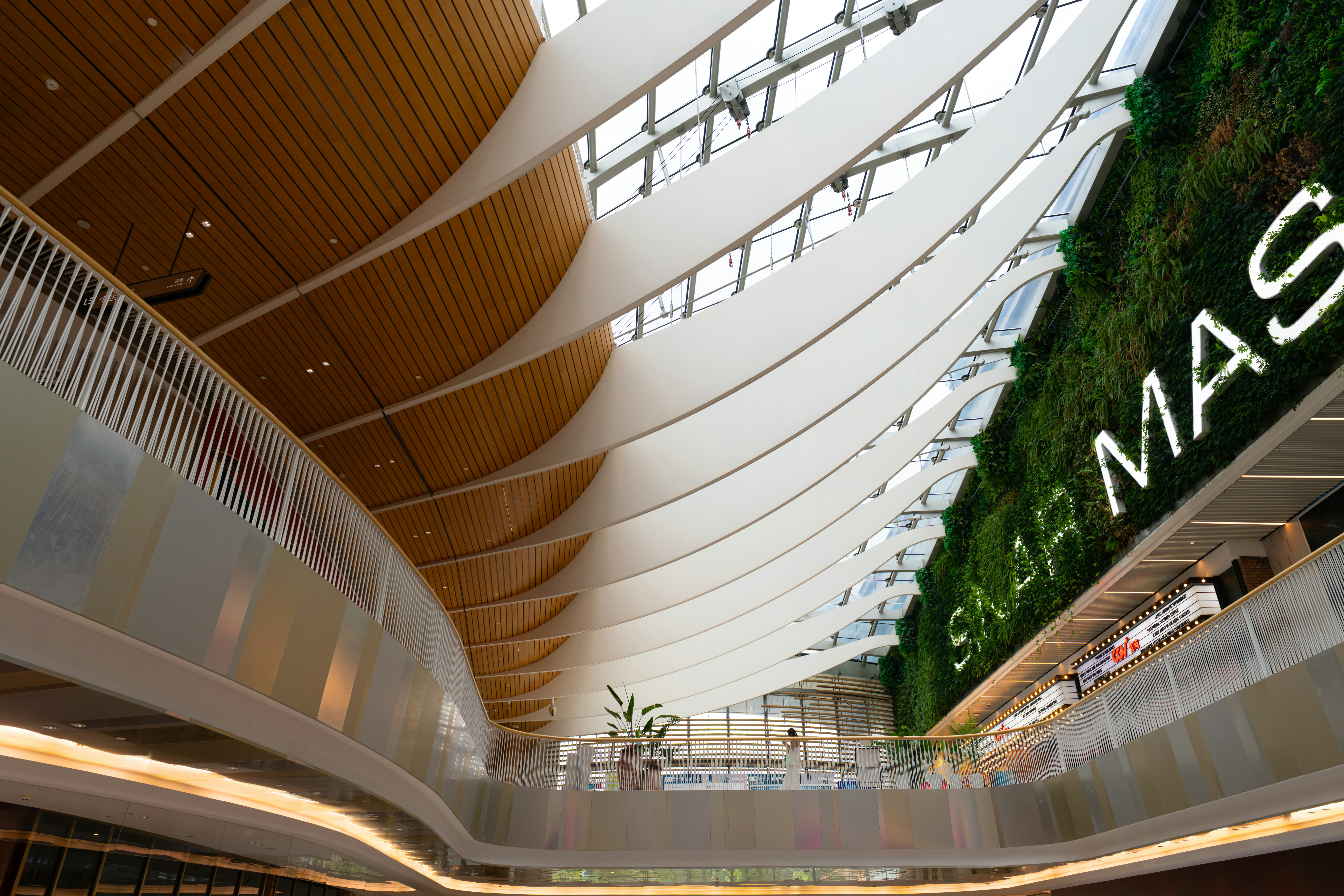 Architected Light: Wave-like Ceiling and Vertical Garden in a Modern Atrium