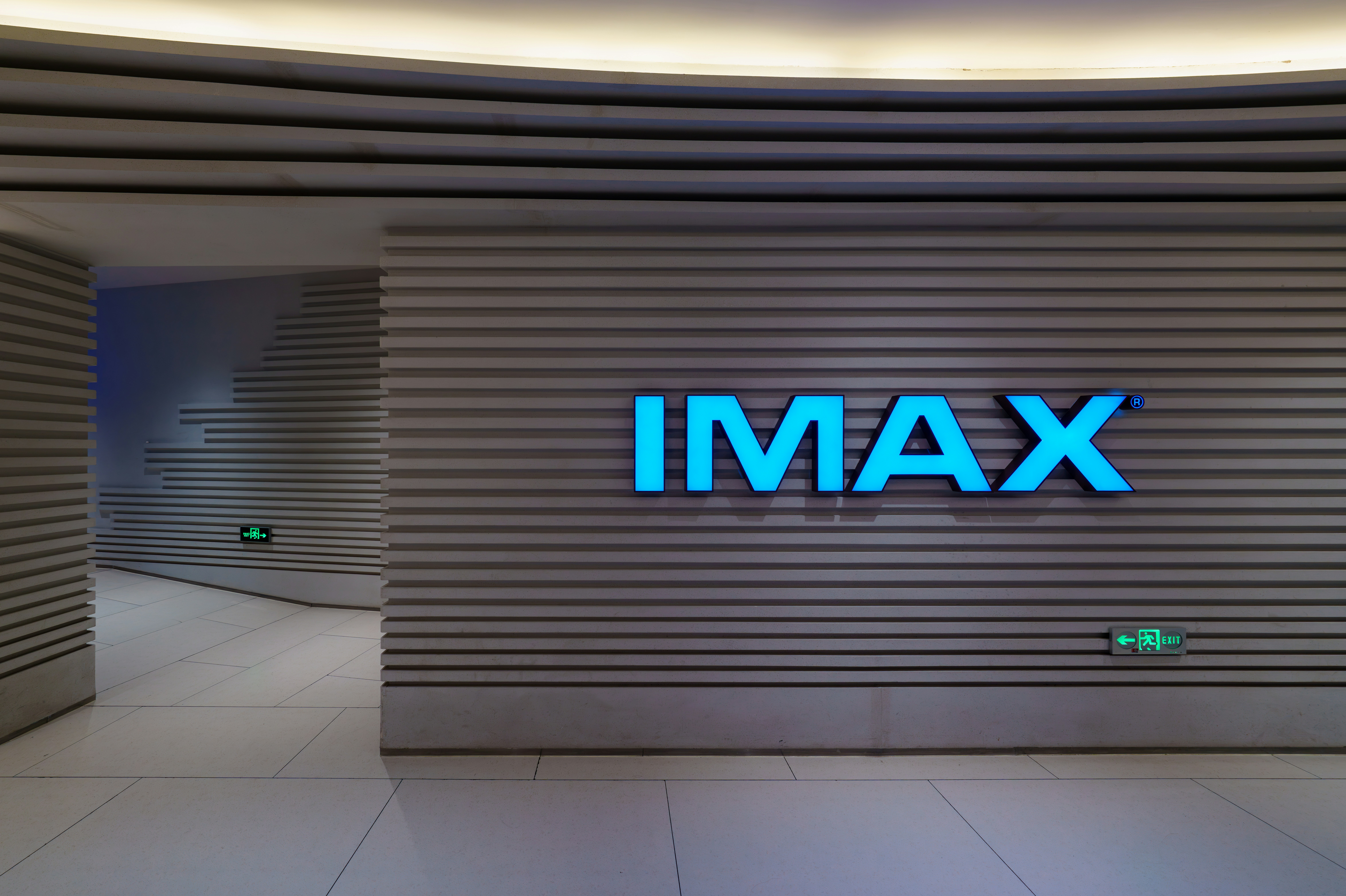 Blue IMAX Sign in a Quiet Corridor
