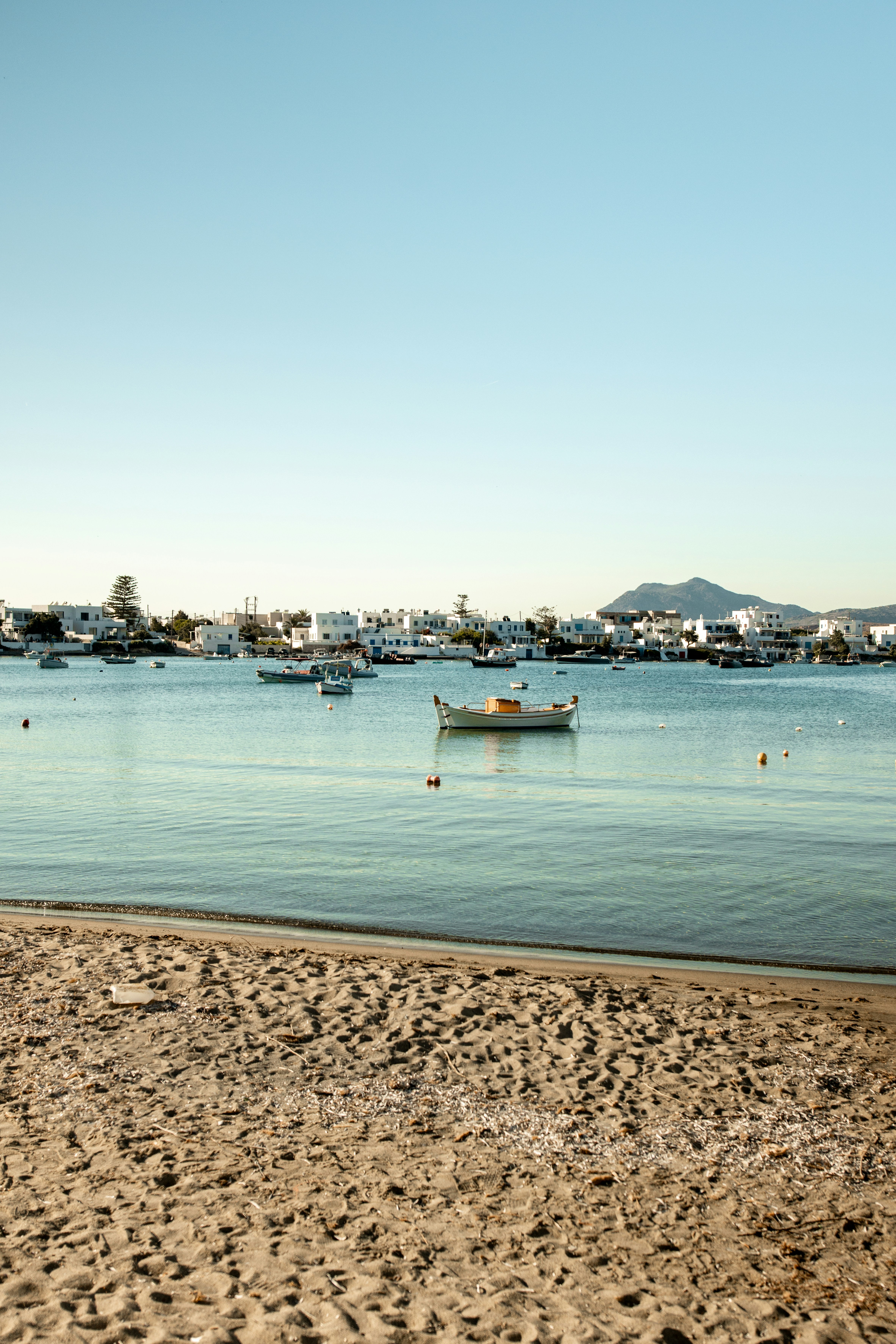 Calm Harbor at Dusk: A Quiet Seascape with a Lone Boat