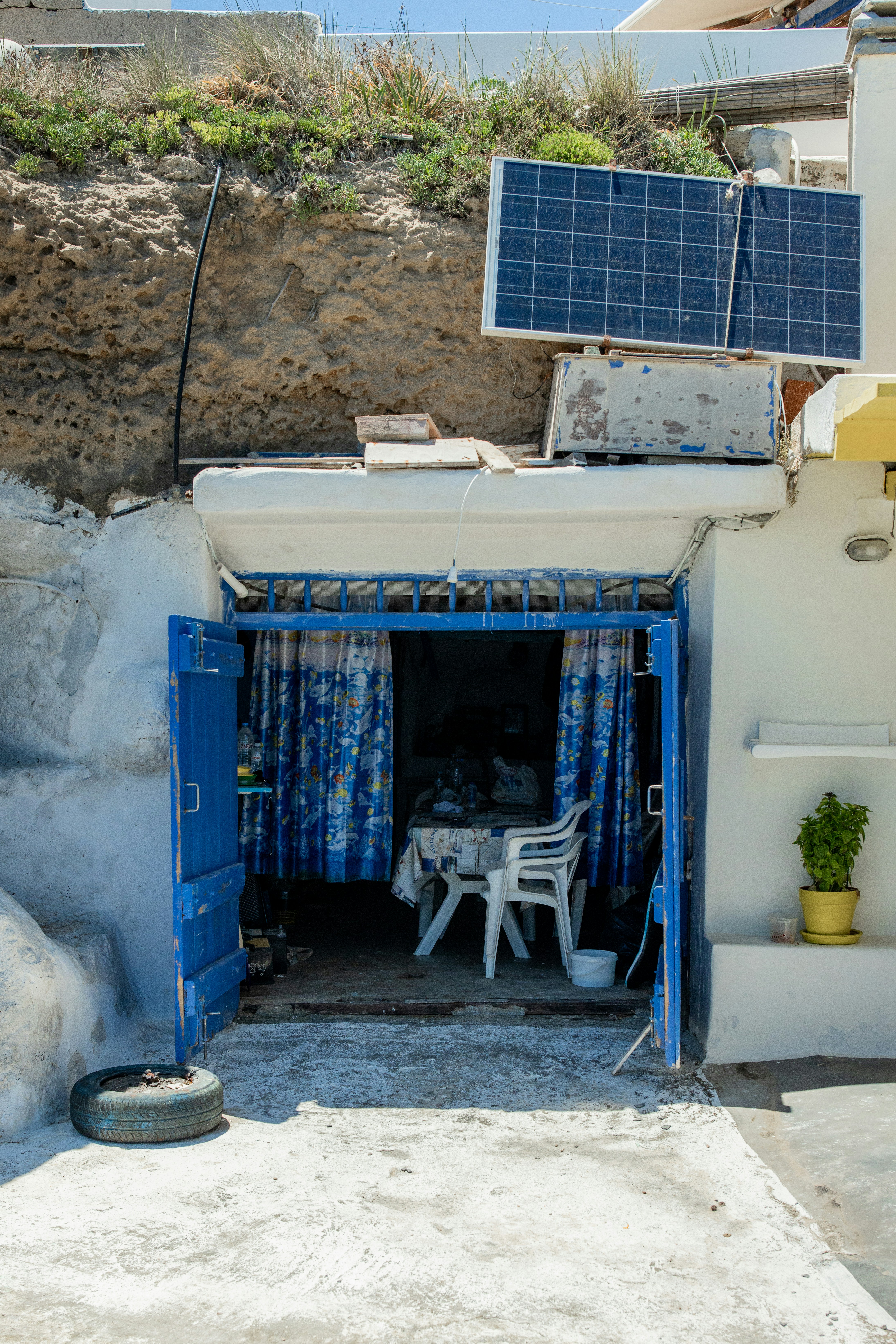 Blue Doorway Bistro Under a Solar Panel Sky
