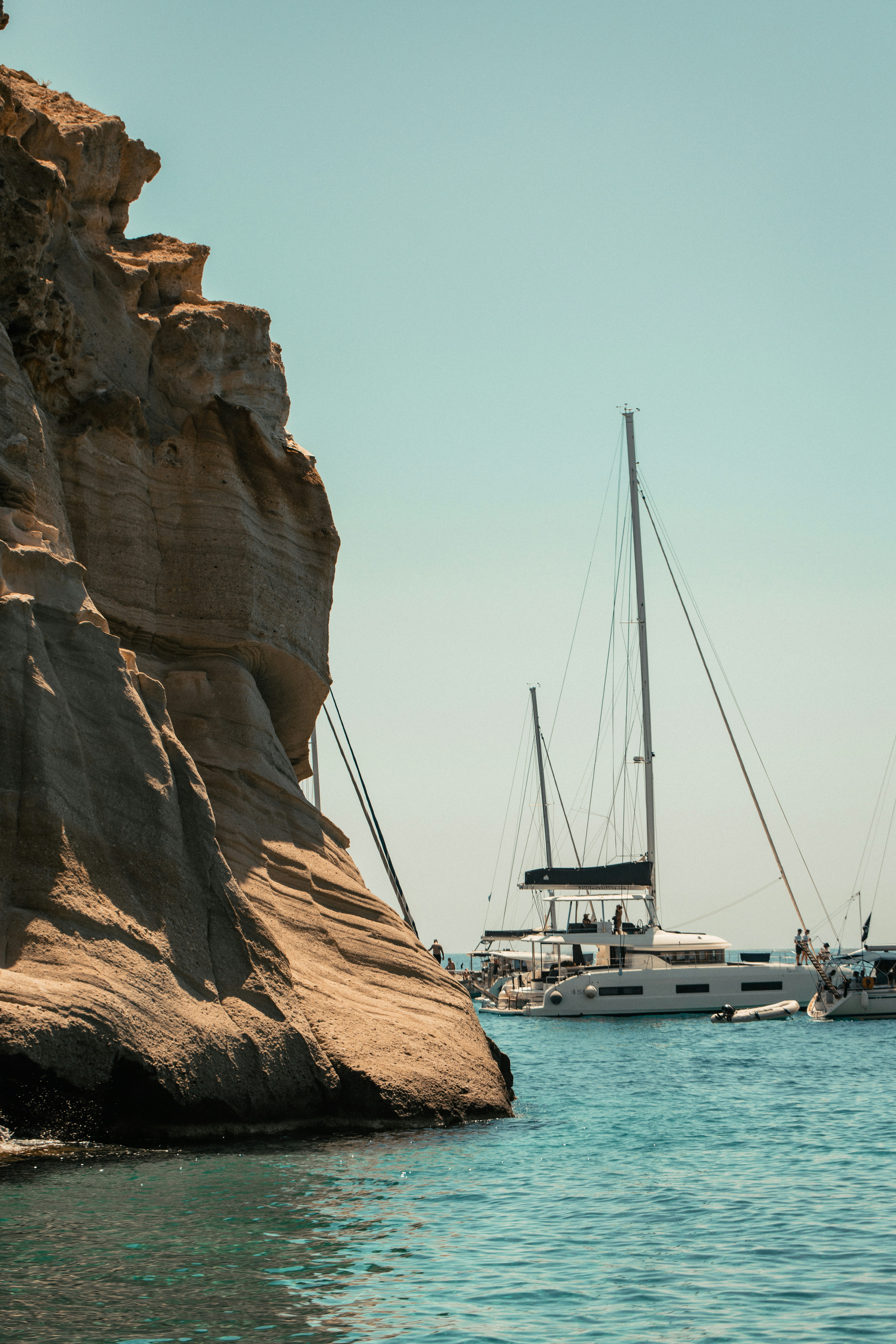 Cliffside Mooring: Quiet Blue Water Meeting Sailboats