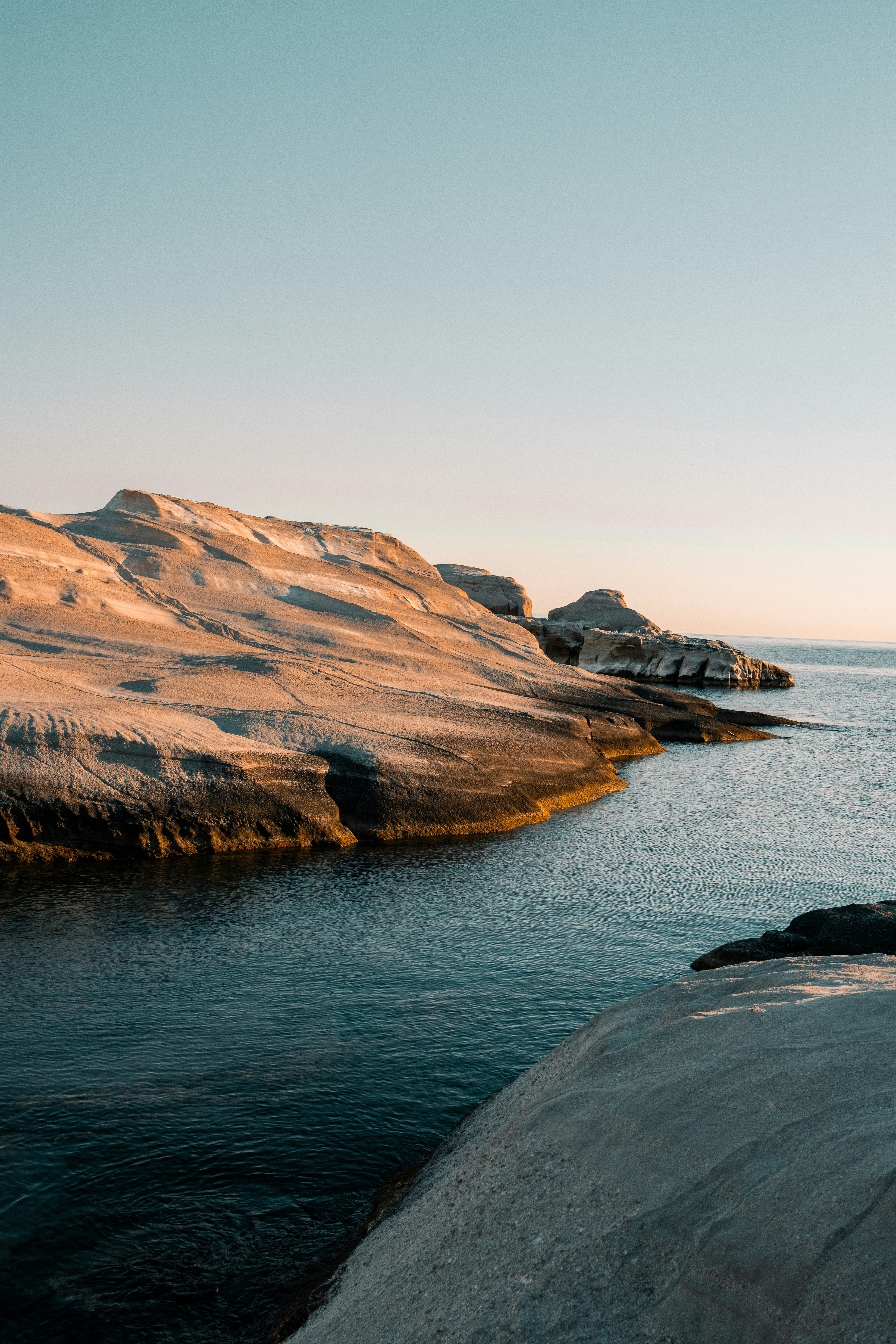 Sunlit Tidal Carved Ridge by Quiet Sea