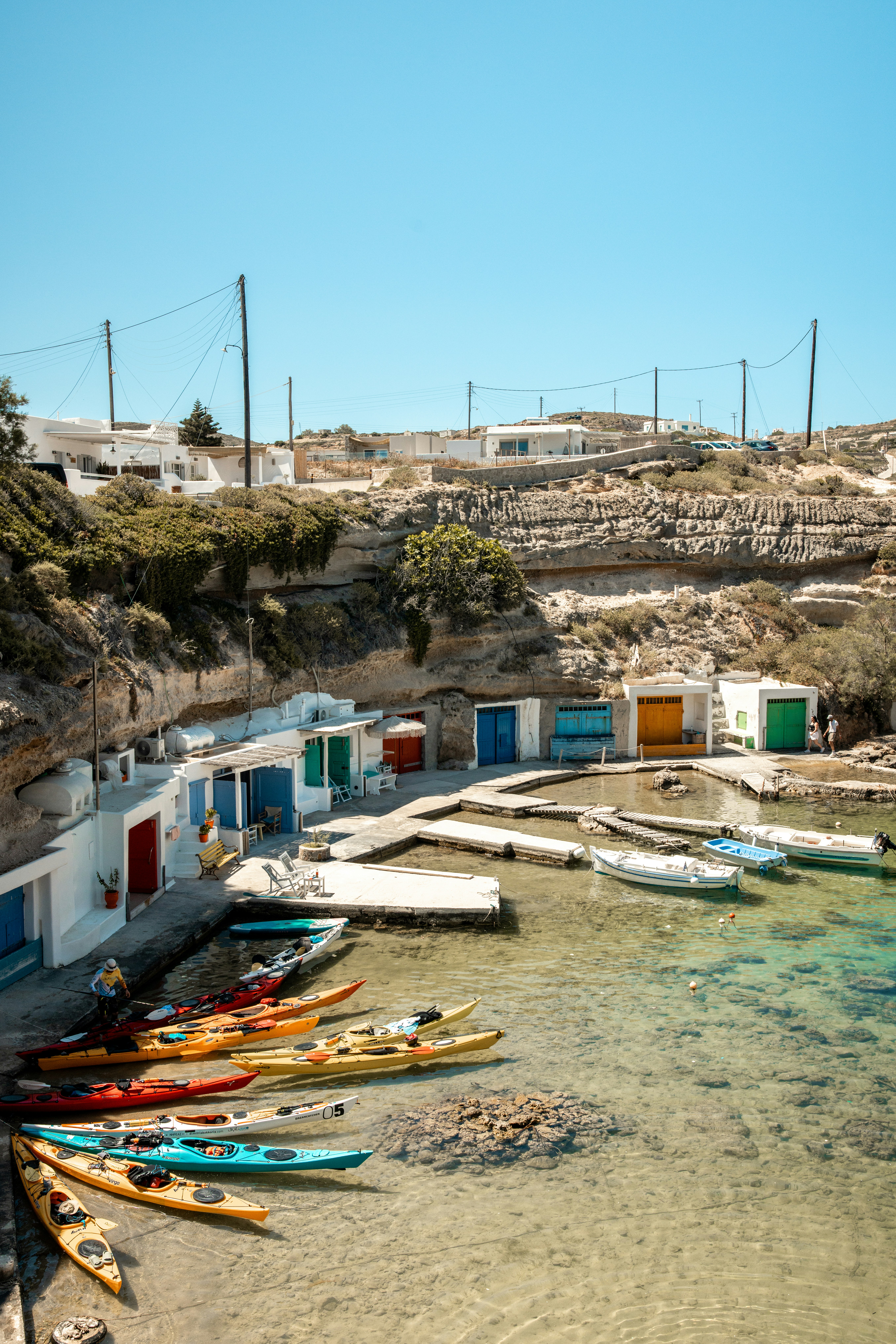 Colorful Boats Docked in a Sunlit Cove