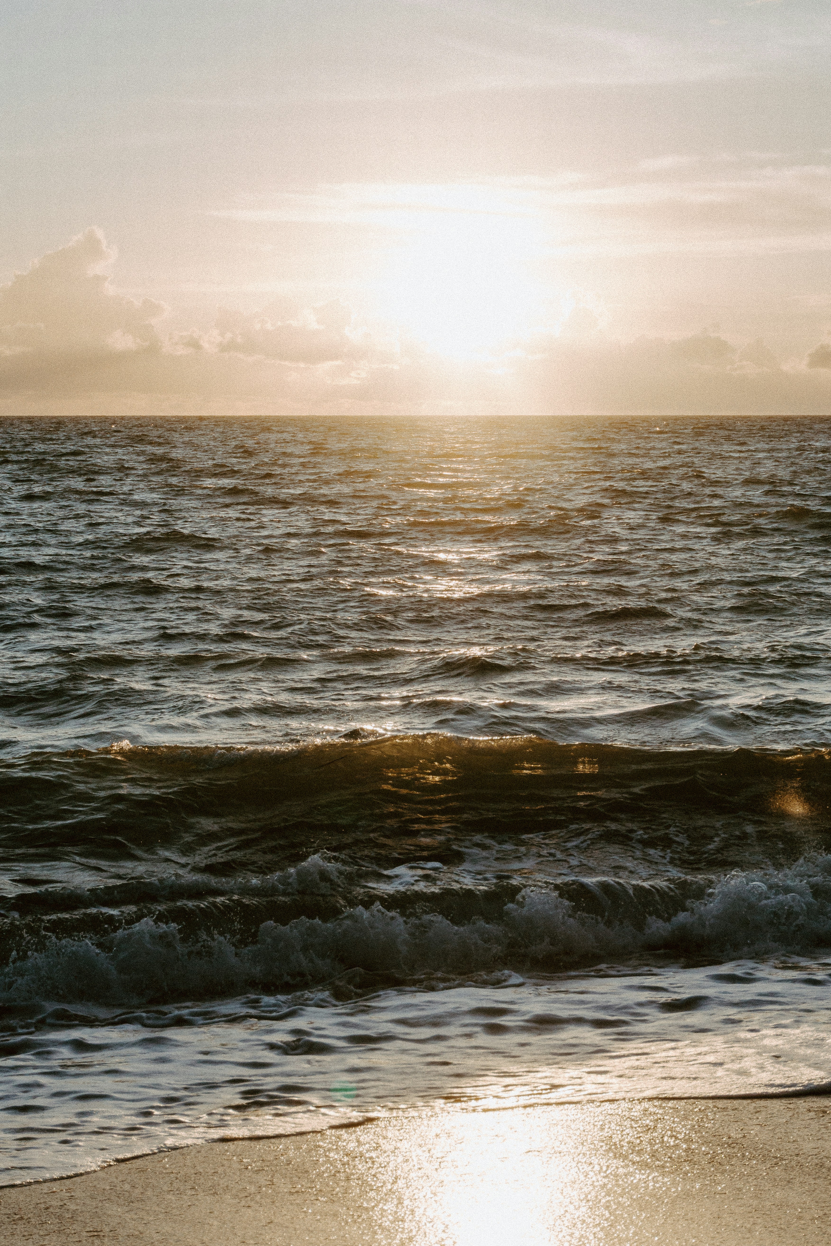 Golden Horizon: Sunlit Seascape at Dusk