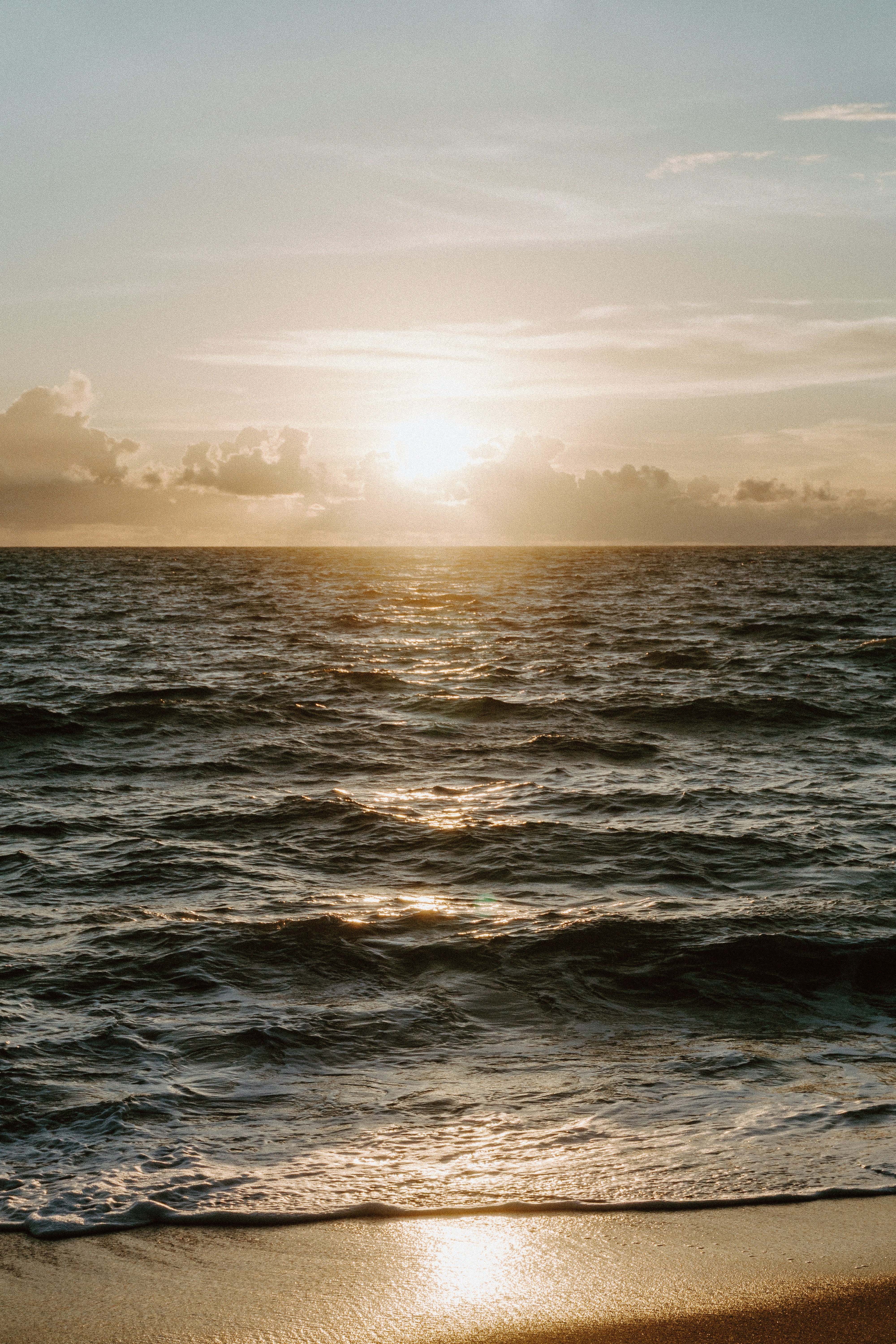 Toward the Quiet Horizon: Sunset Over Gentle Seas
