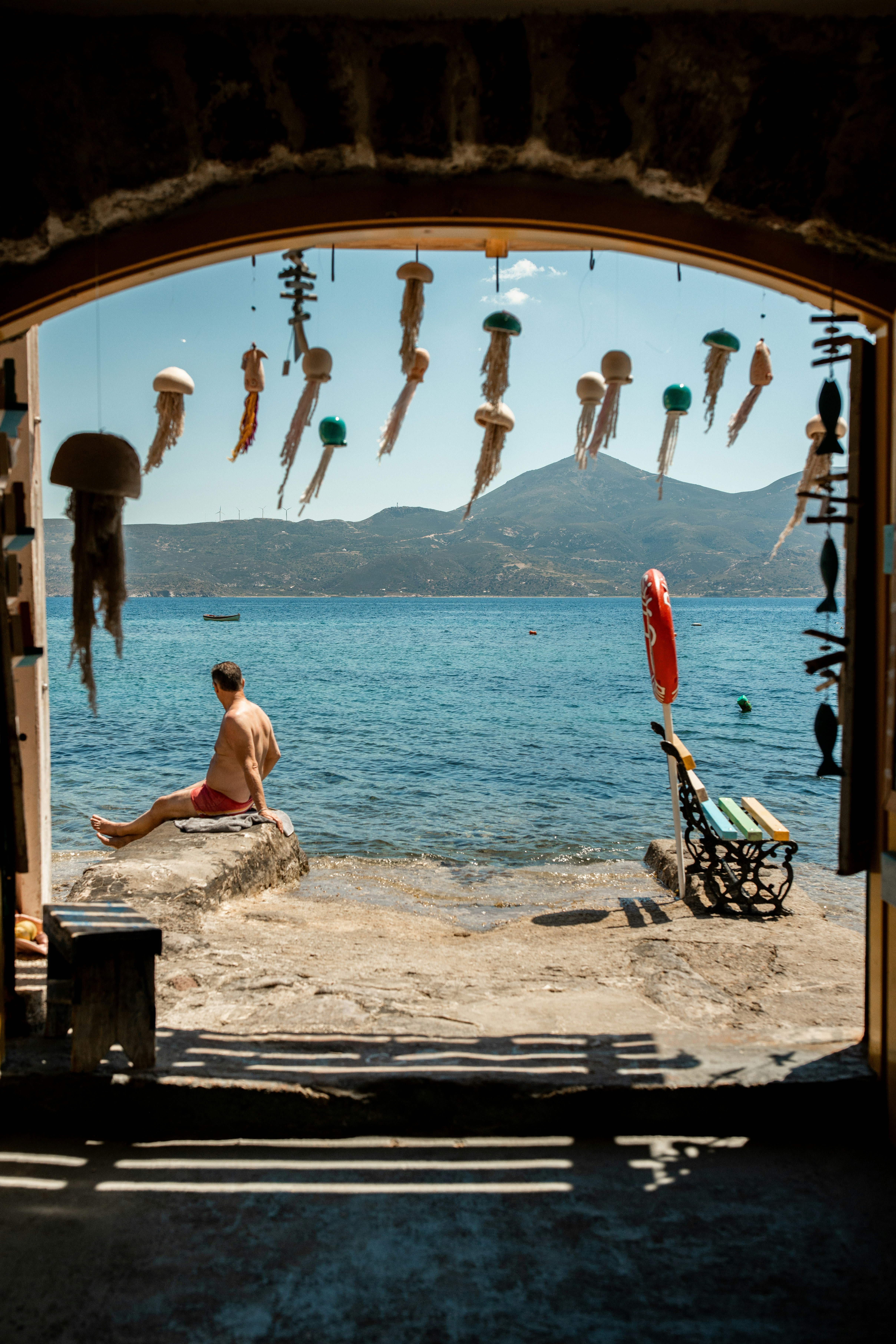 Harbor Window: A Quiet Shore Seen Through a Tide-Jewelled Arch