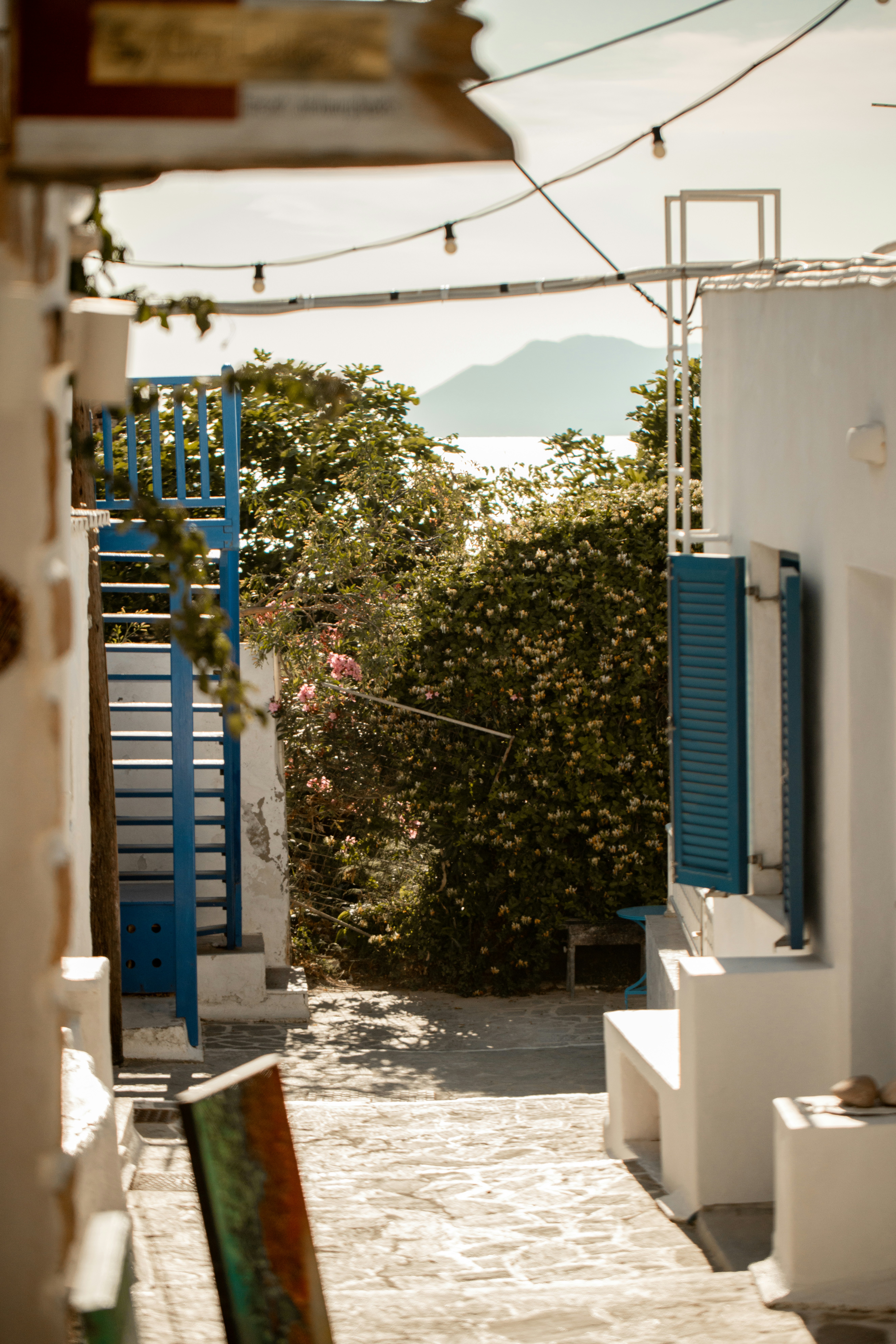 Blue Doors & Sunlit Alley to a Distant Sea