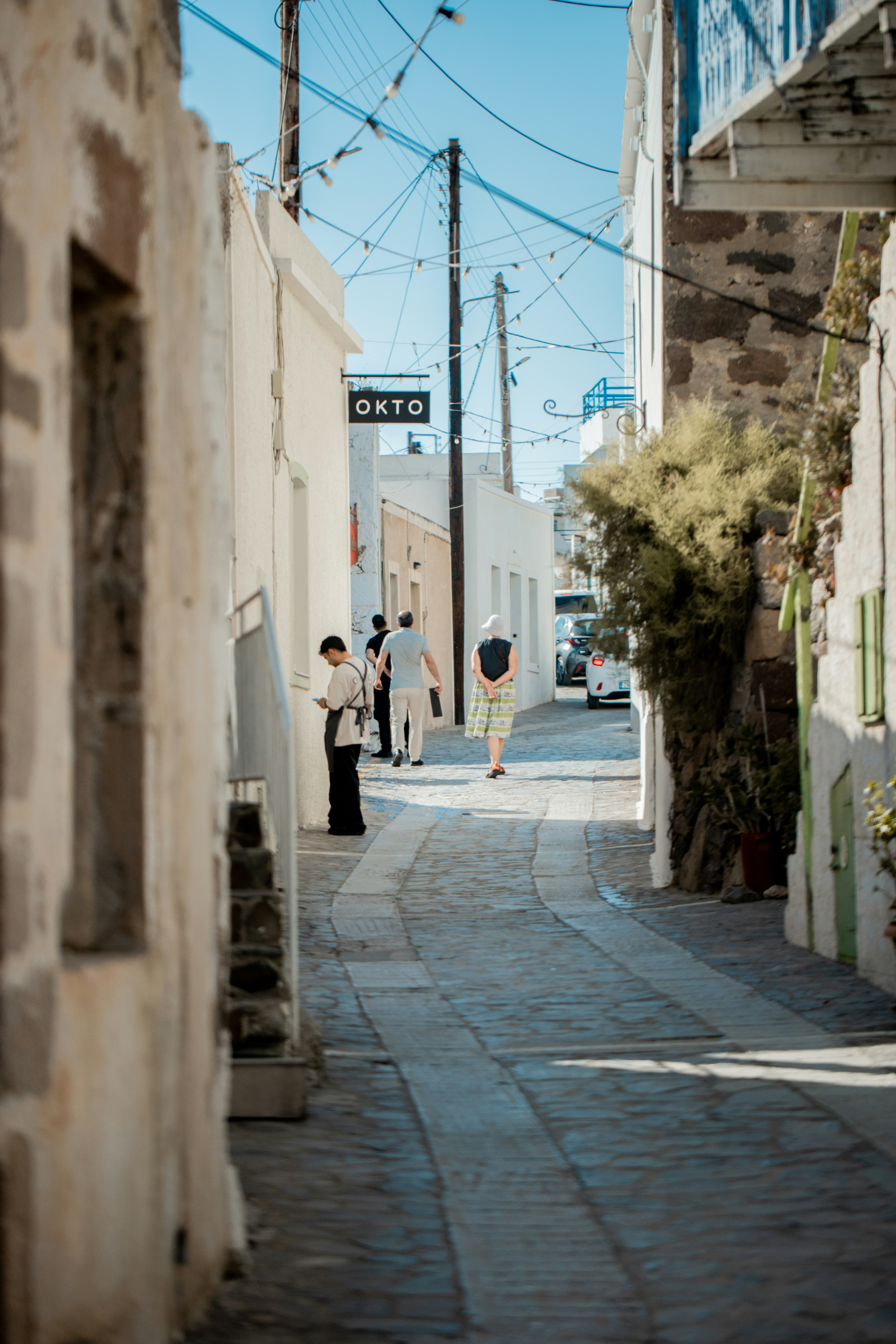 Alleyway Intersection: Quiet Steps Toward the Sunlit Square