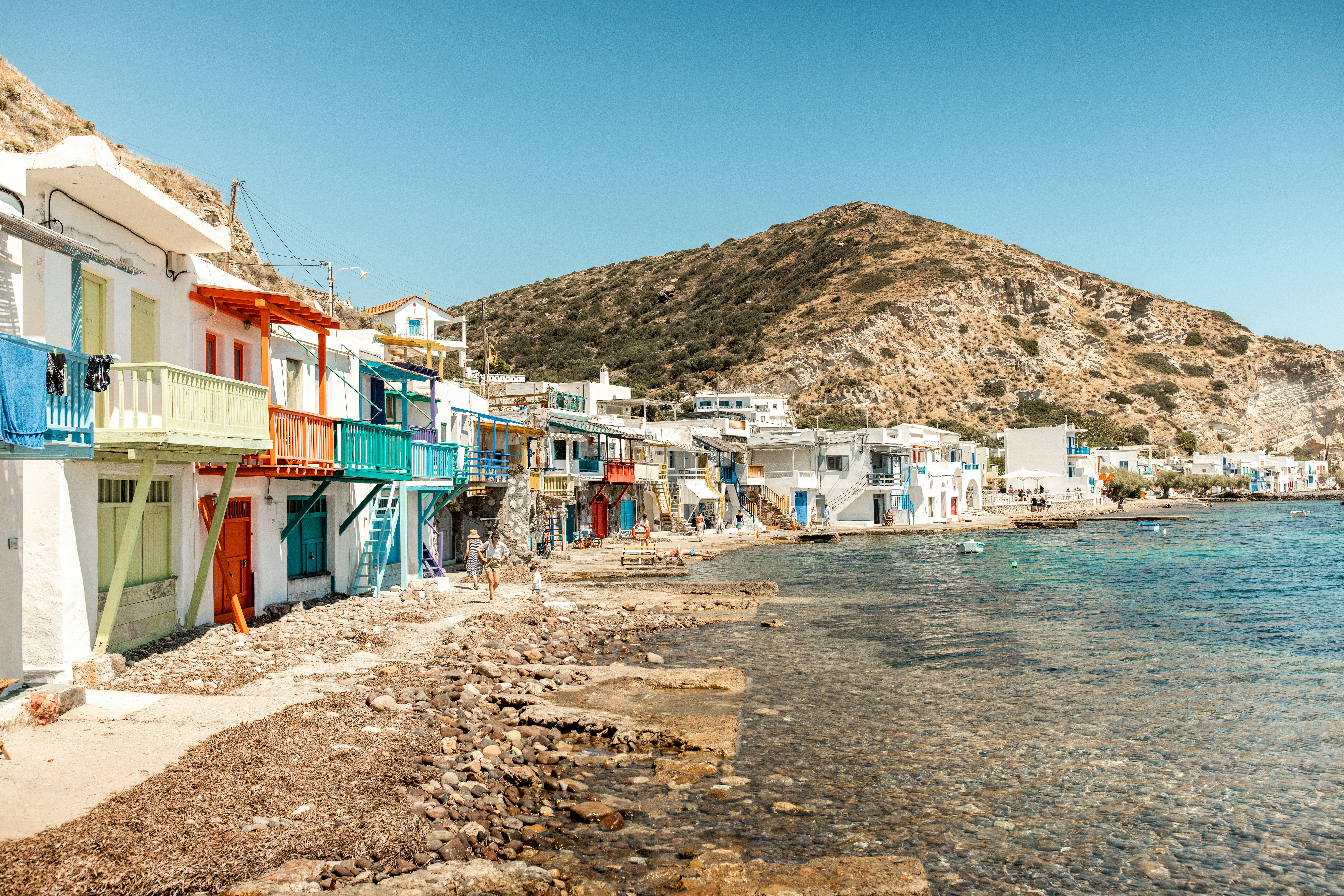 Colorful Waterfront Lane with Mountain Backdrop