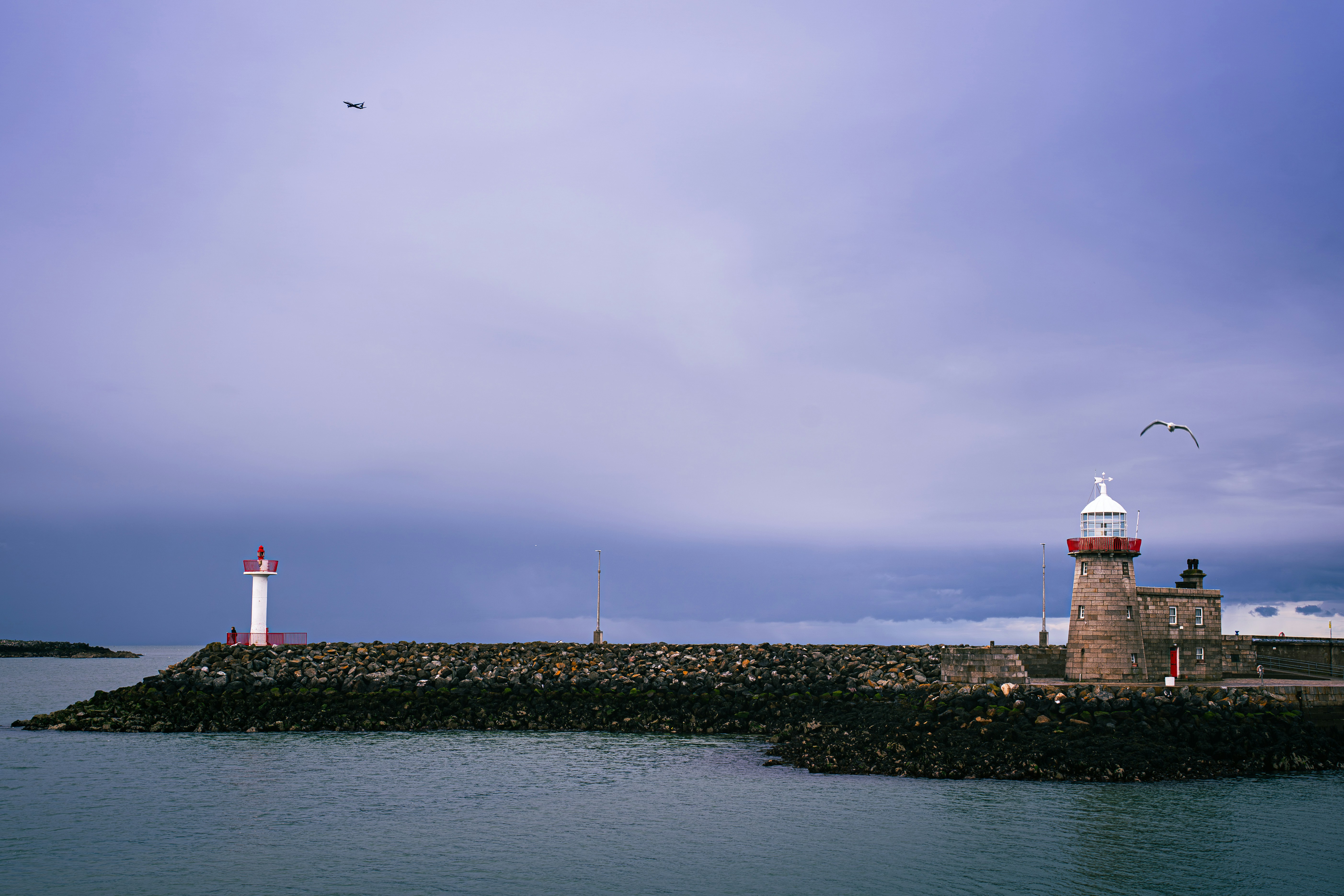 Twin Lighthouses at a Calm Breakwater