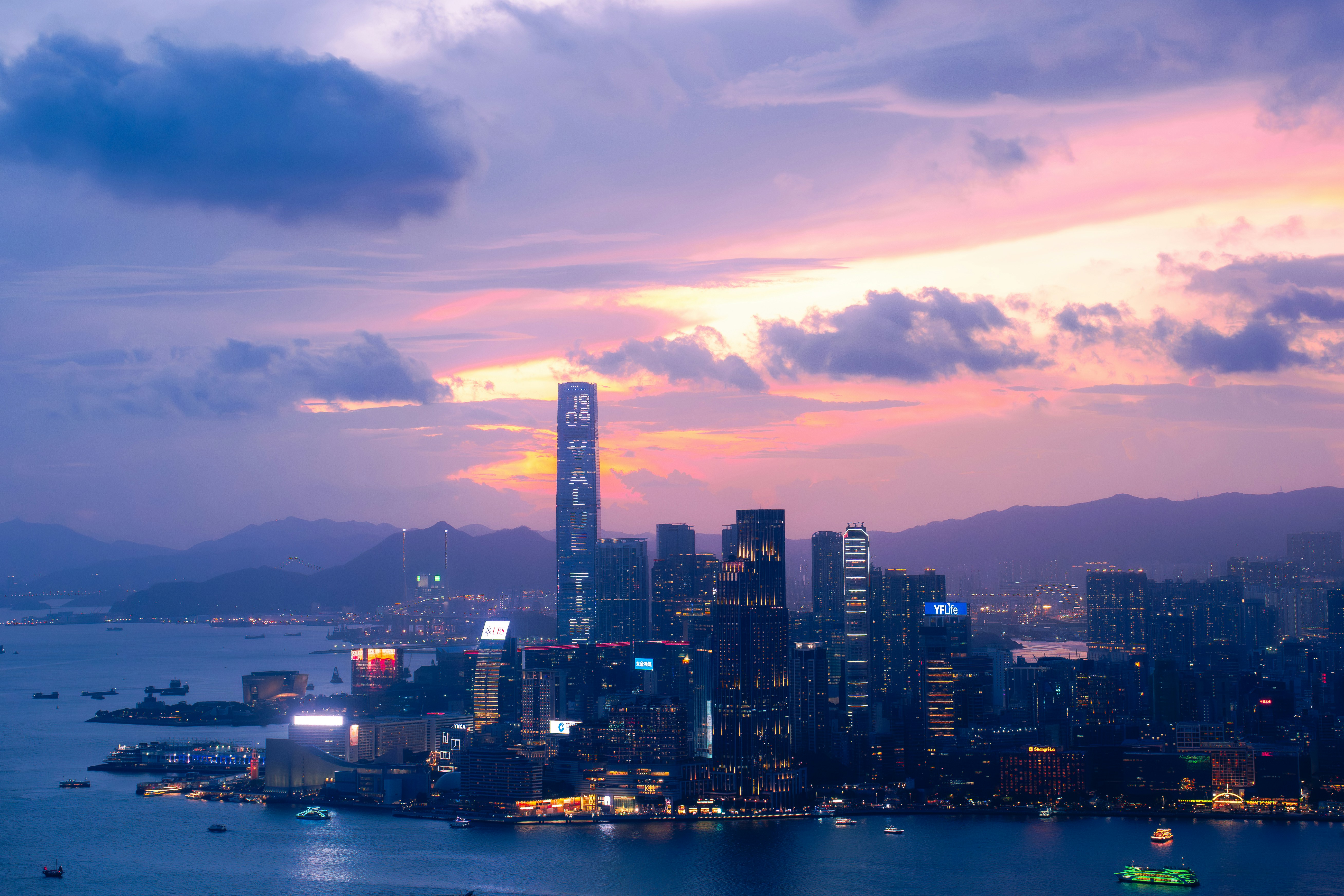 Dusk over Victoria Harbour: Neon Skyline at Migrant Light