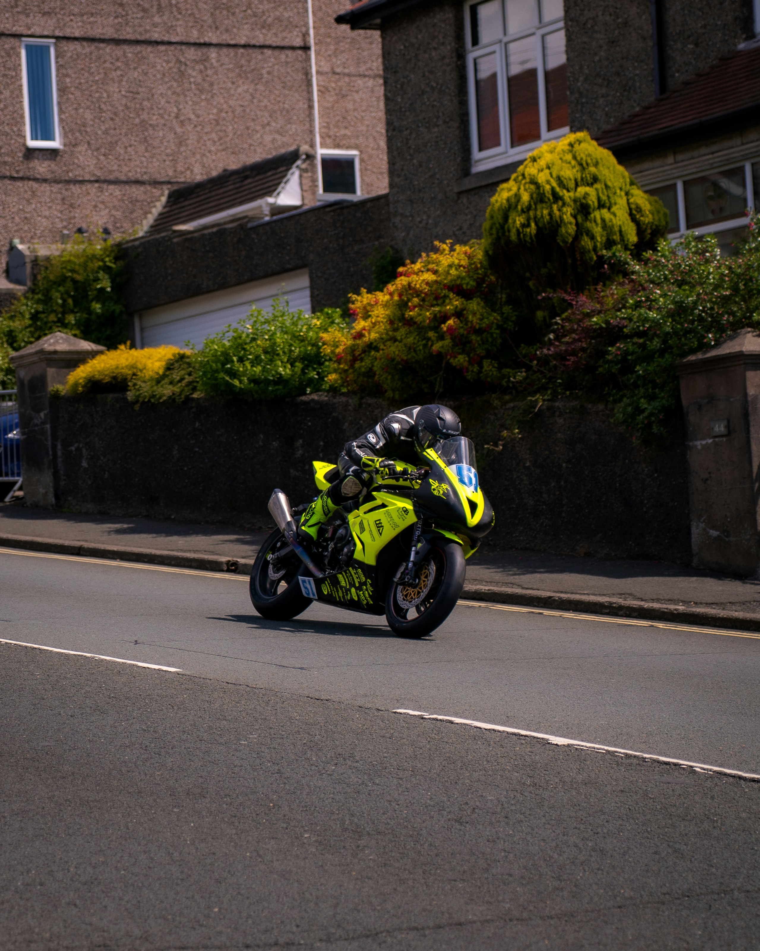Neon Rider on a Quiet Suburban Street
