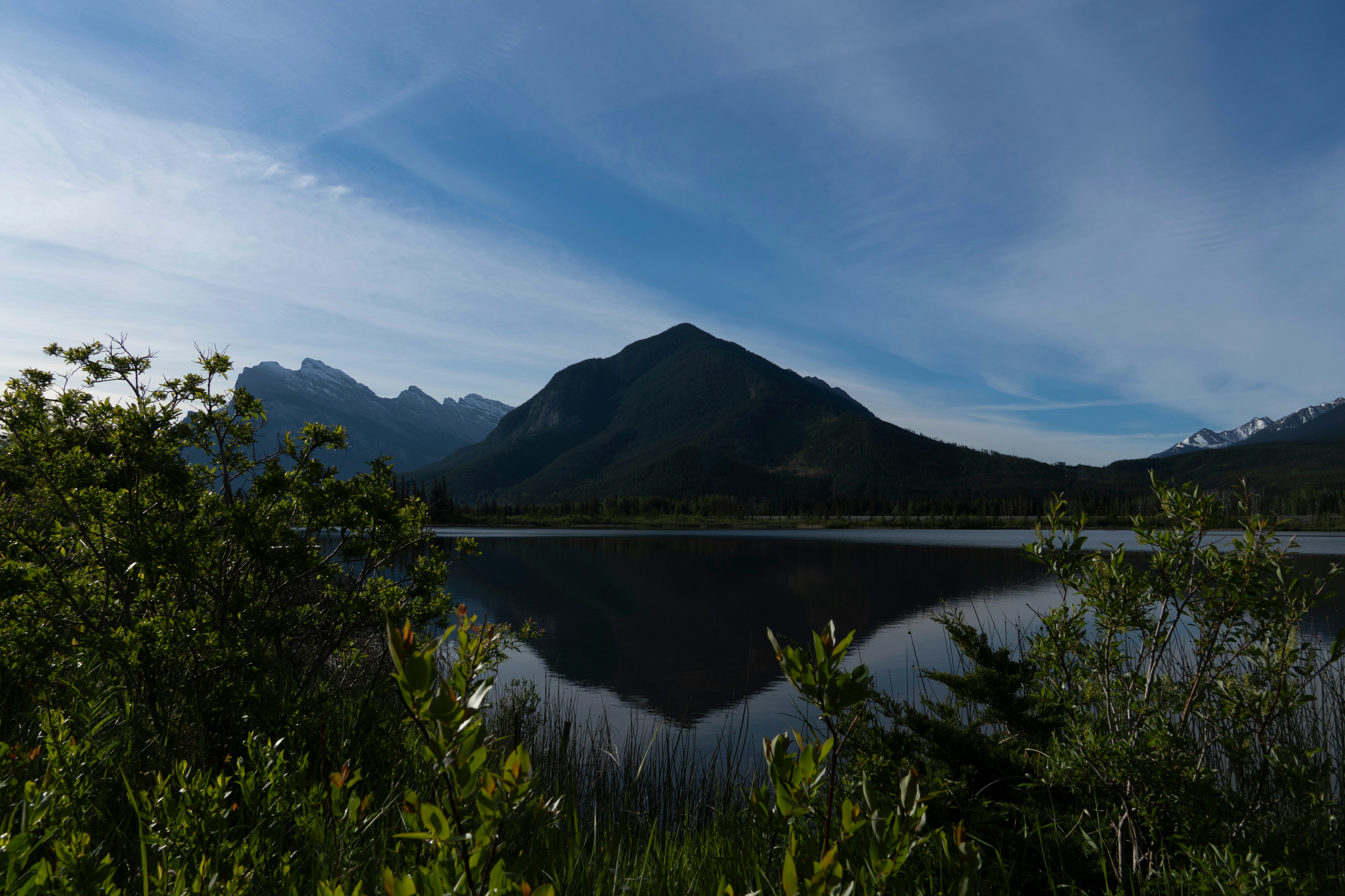 Serene Alpine Mirror: Mountains Framed by Quiet Lake