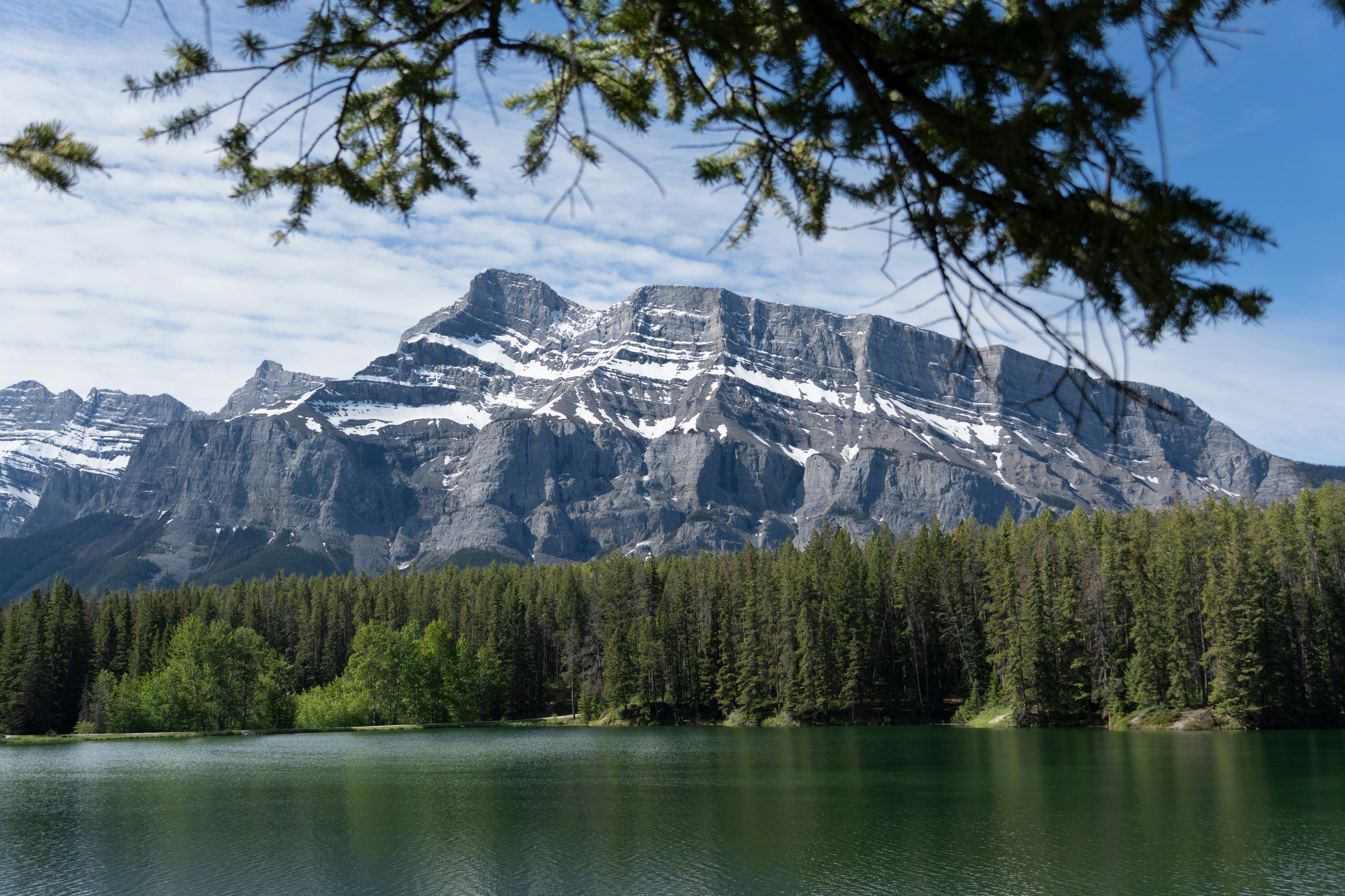 Snow-kissed Peak Over a Quiet Lake