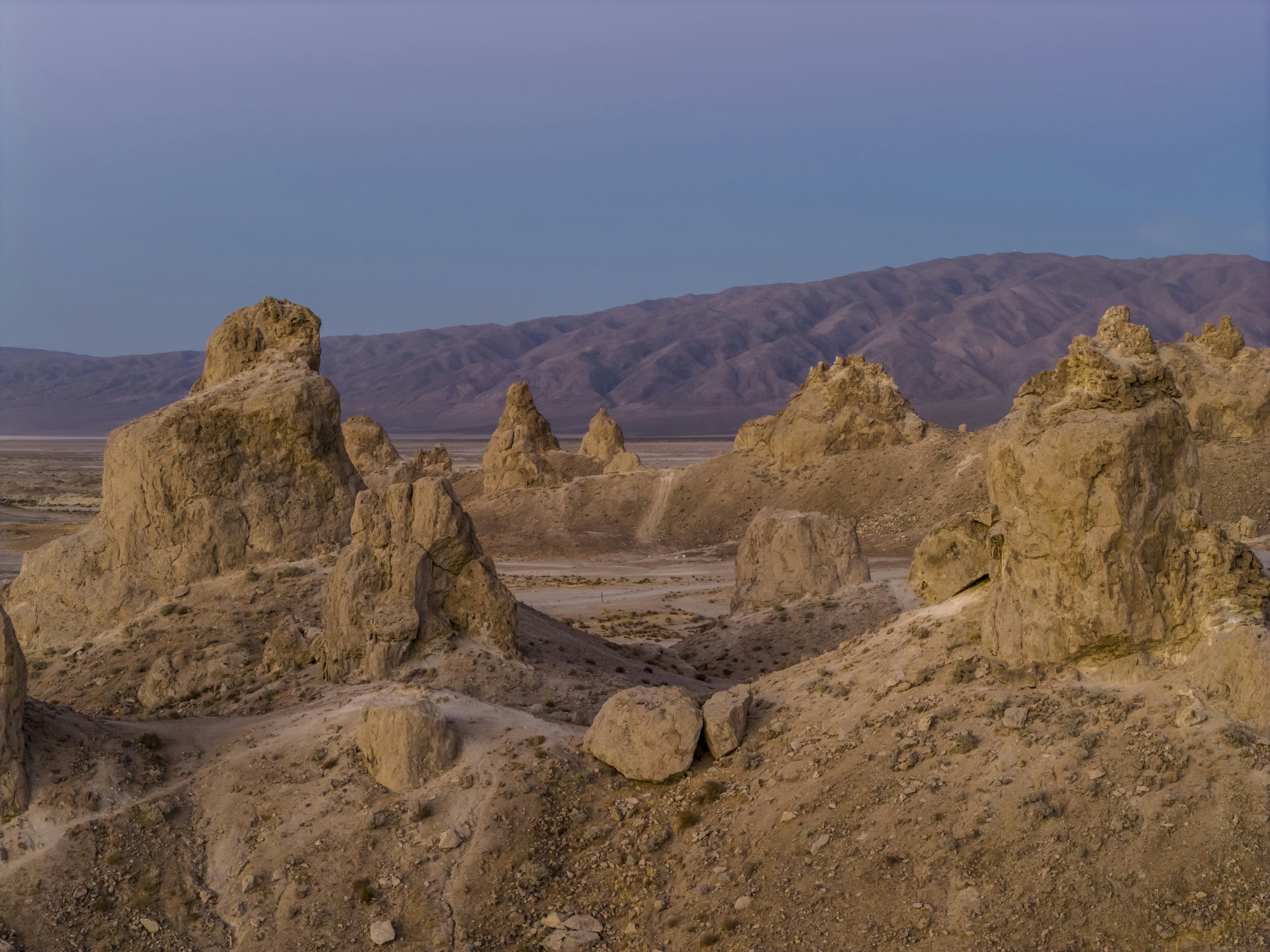Desert Pillars at Dusk: Echoes of Granite in a Quiet Basin