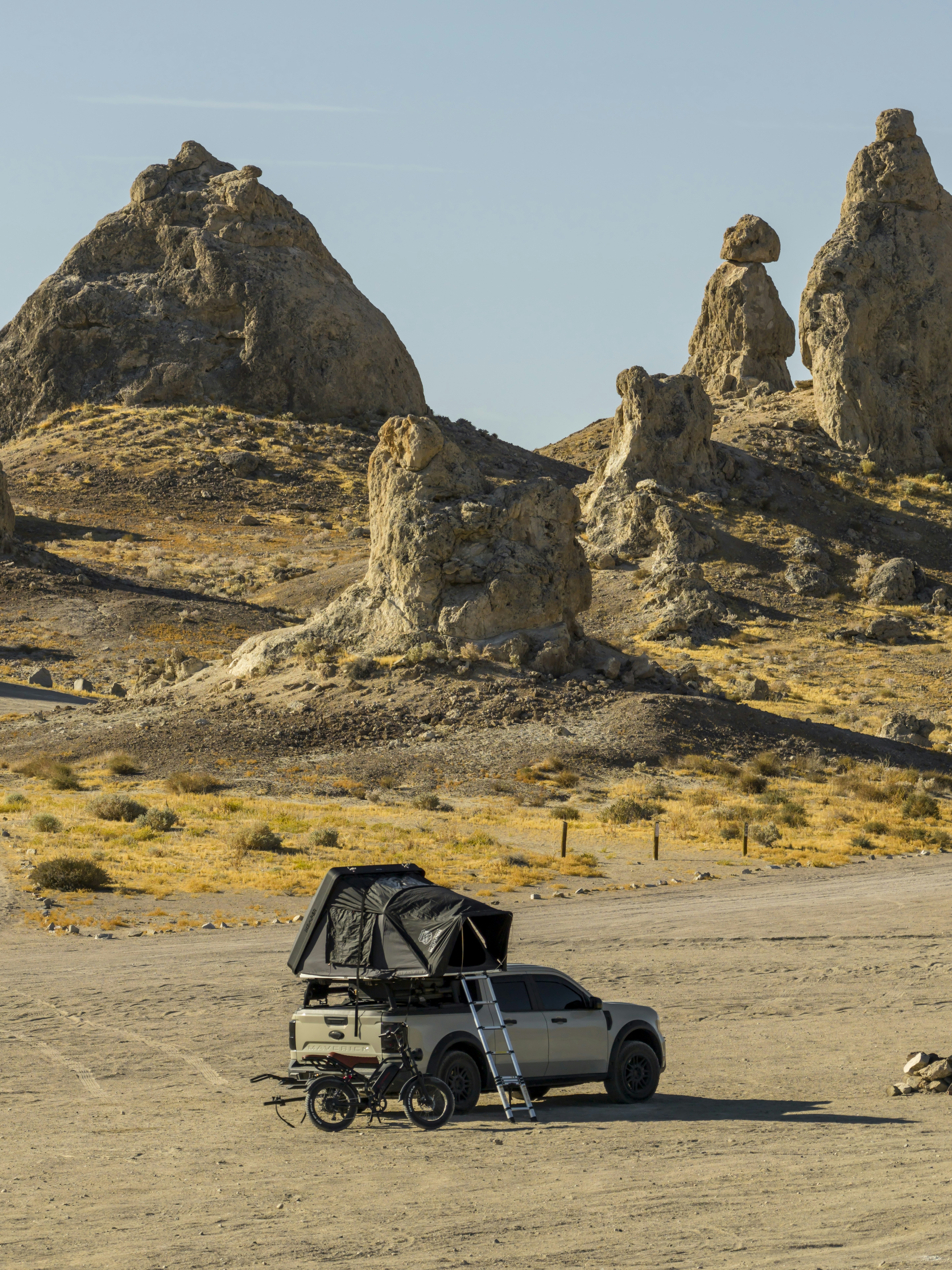 Desert Rock Formations Framed by a Camped SUV