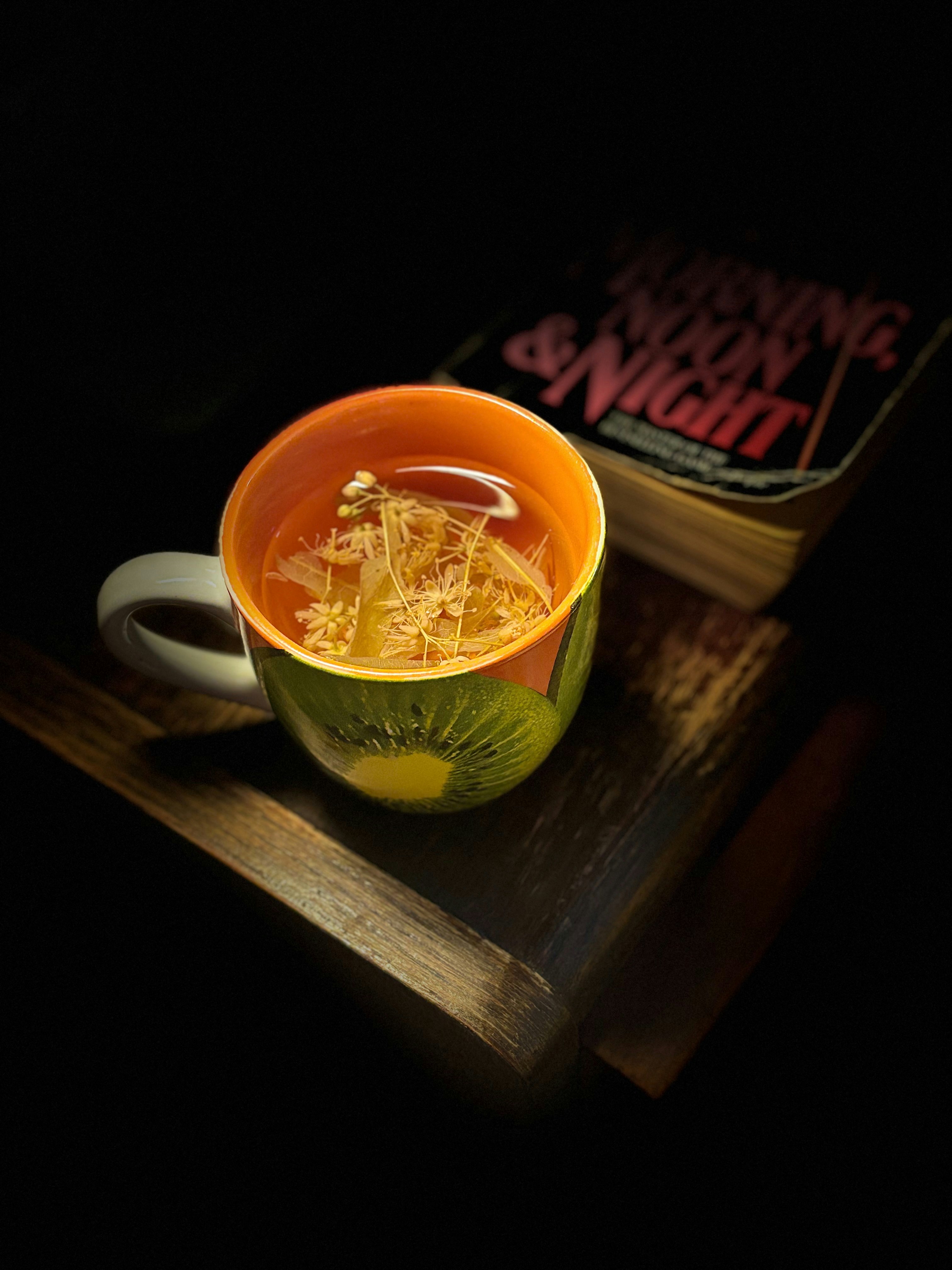 Tea in a Bright Mango Cup: Morning Light on a Wooden Table
