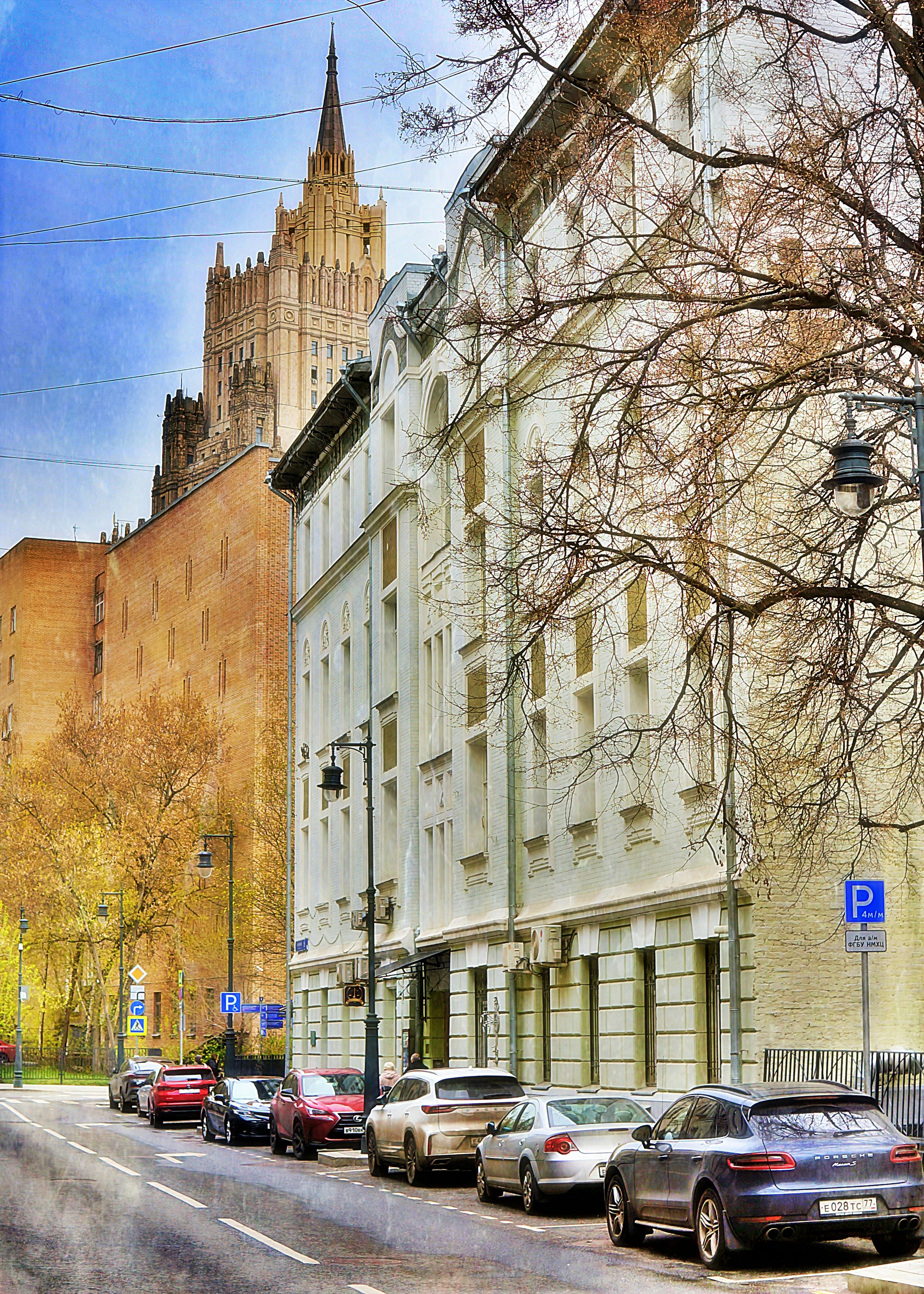 City Street Monoliths: A Towering Gable Over Quiet Row