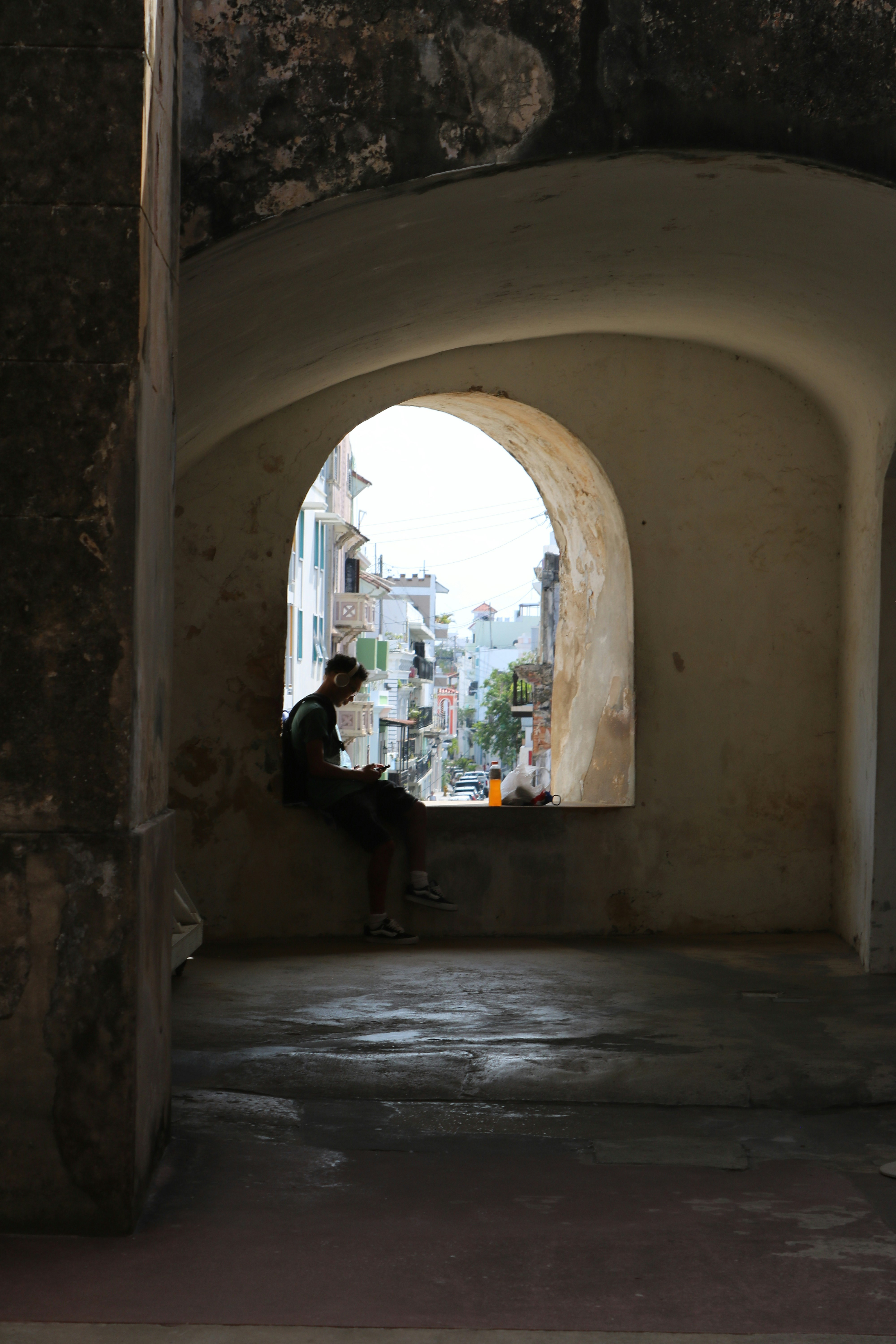 Silhouette in the Arch: Quiet City Window