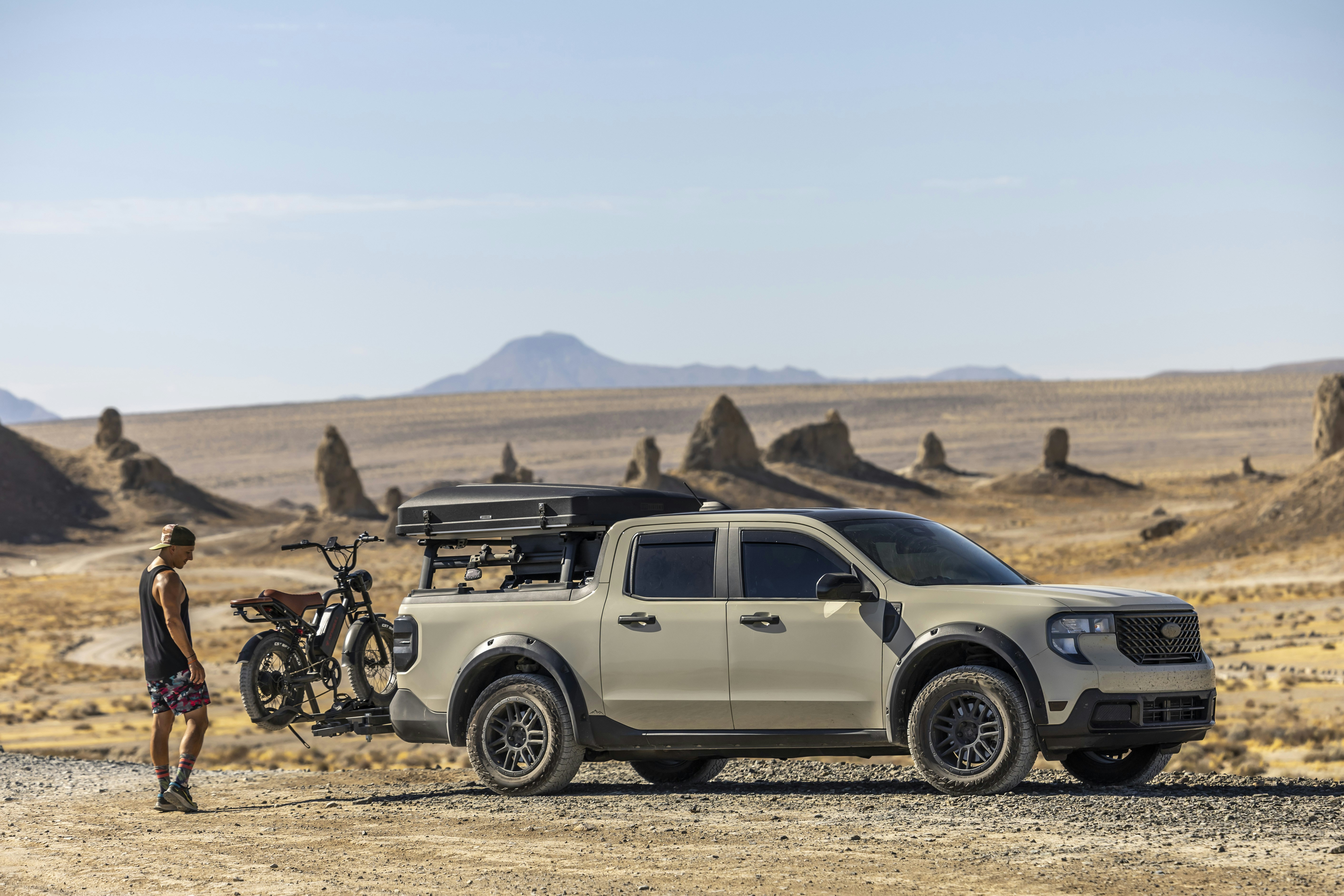 Desert Rendezvous: Utility Truck and Moto Camp in the Dunes