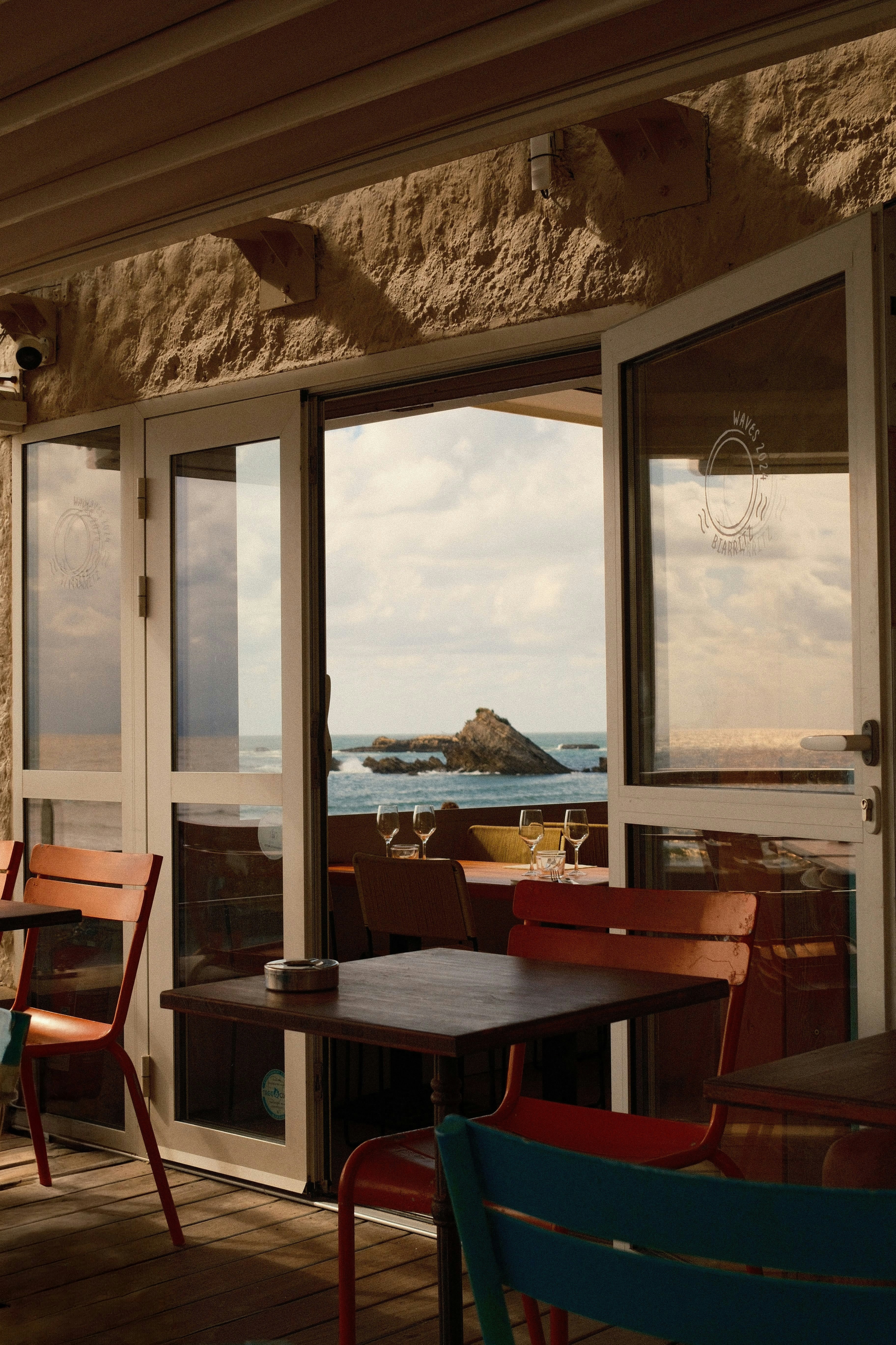Sea View Through an Open Café Door