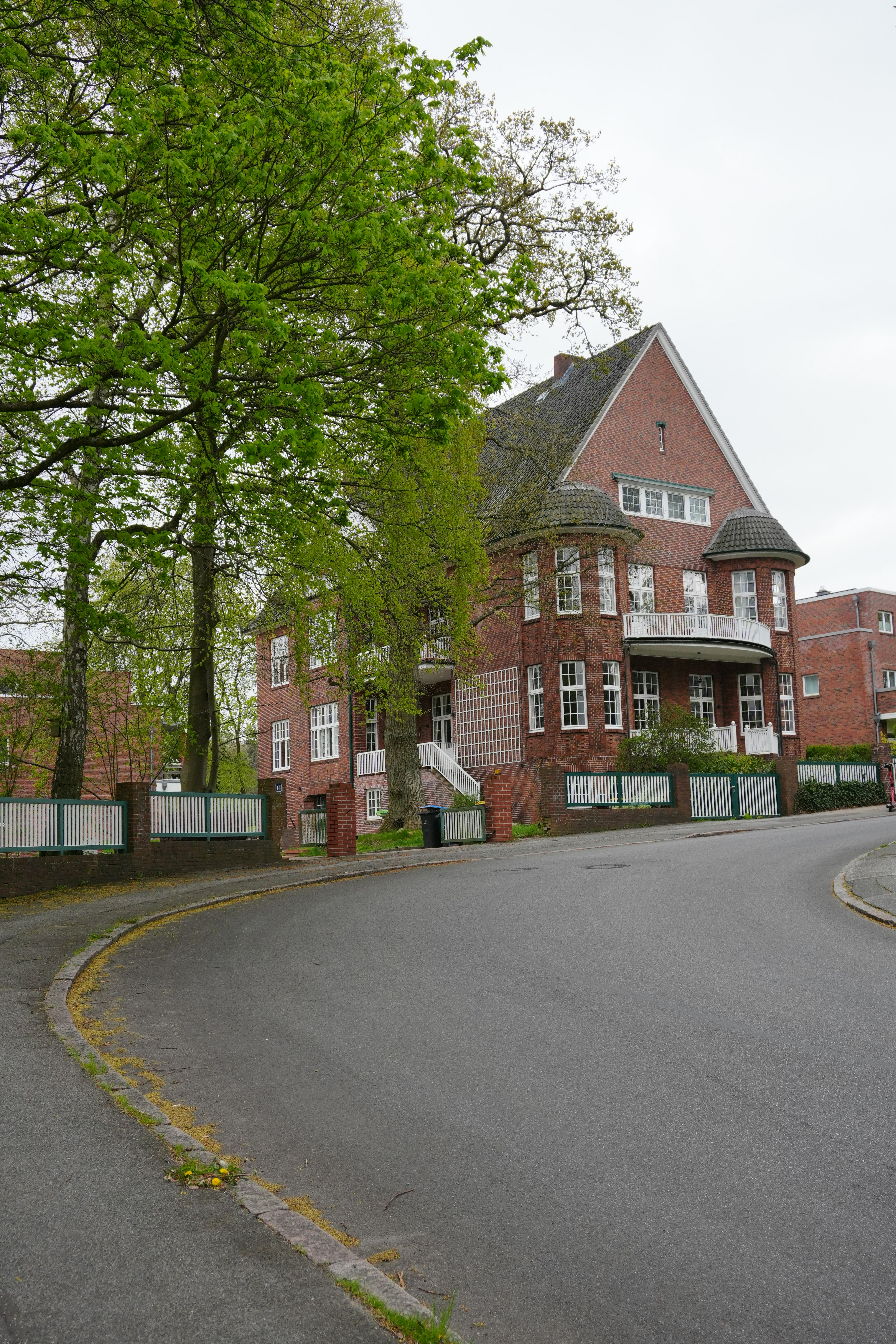 Curved Street Meets Brick Manor: A Quiet Local Ascent