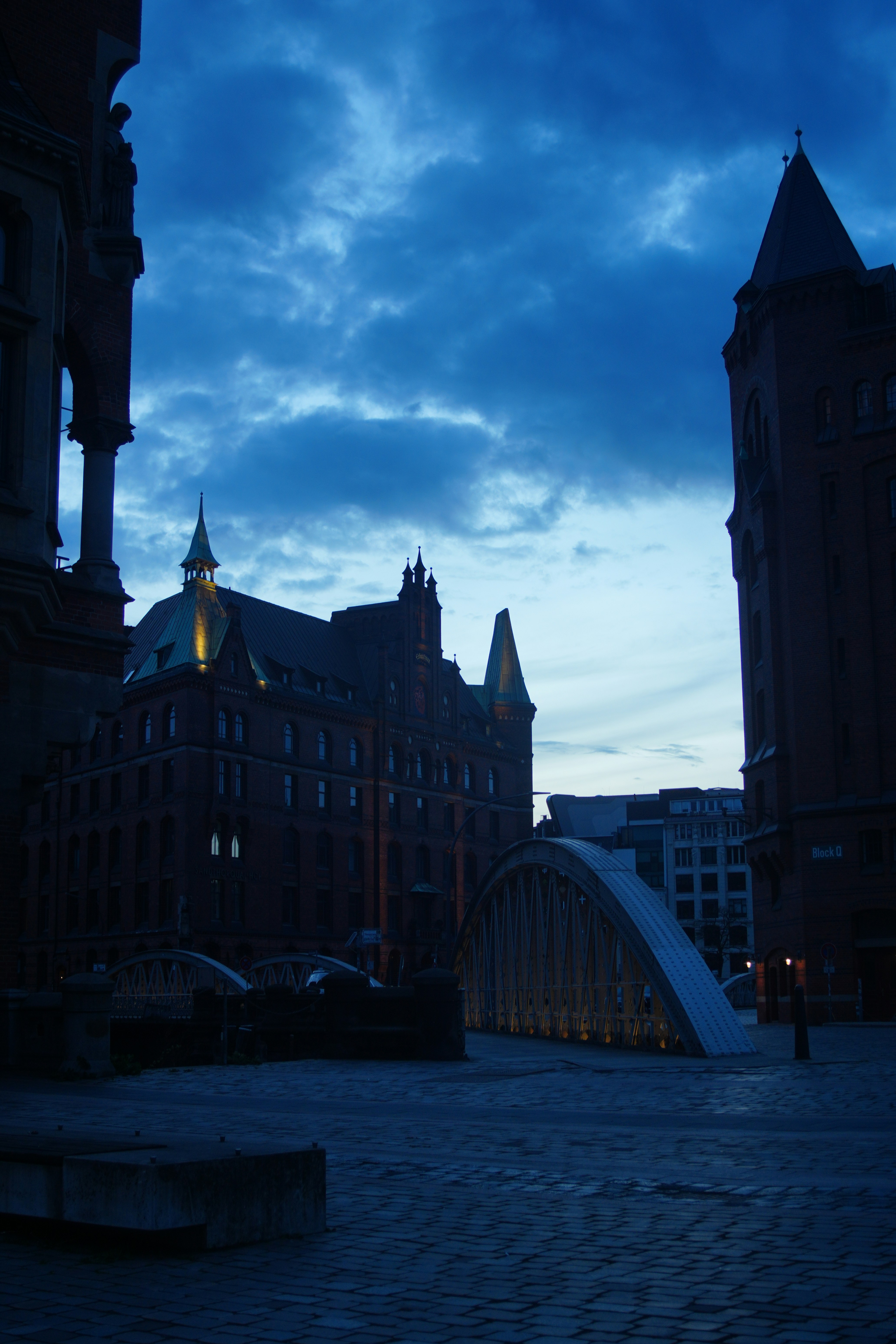 Twilight at the City Bridge: Historic Gables and a Metallic Arc
