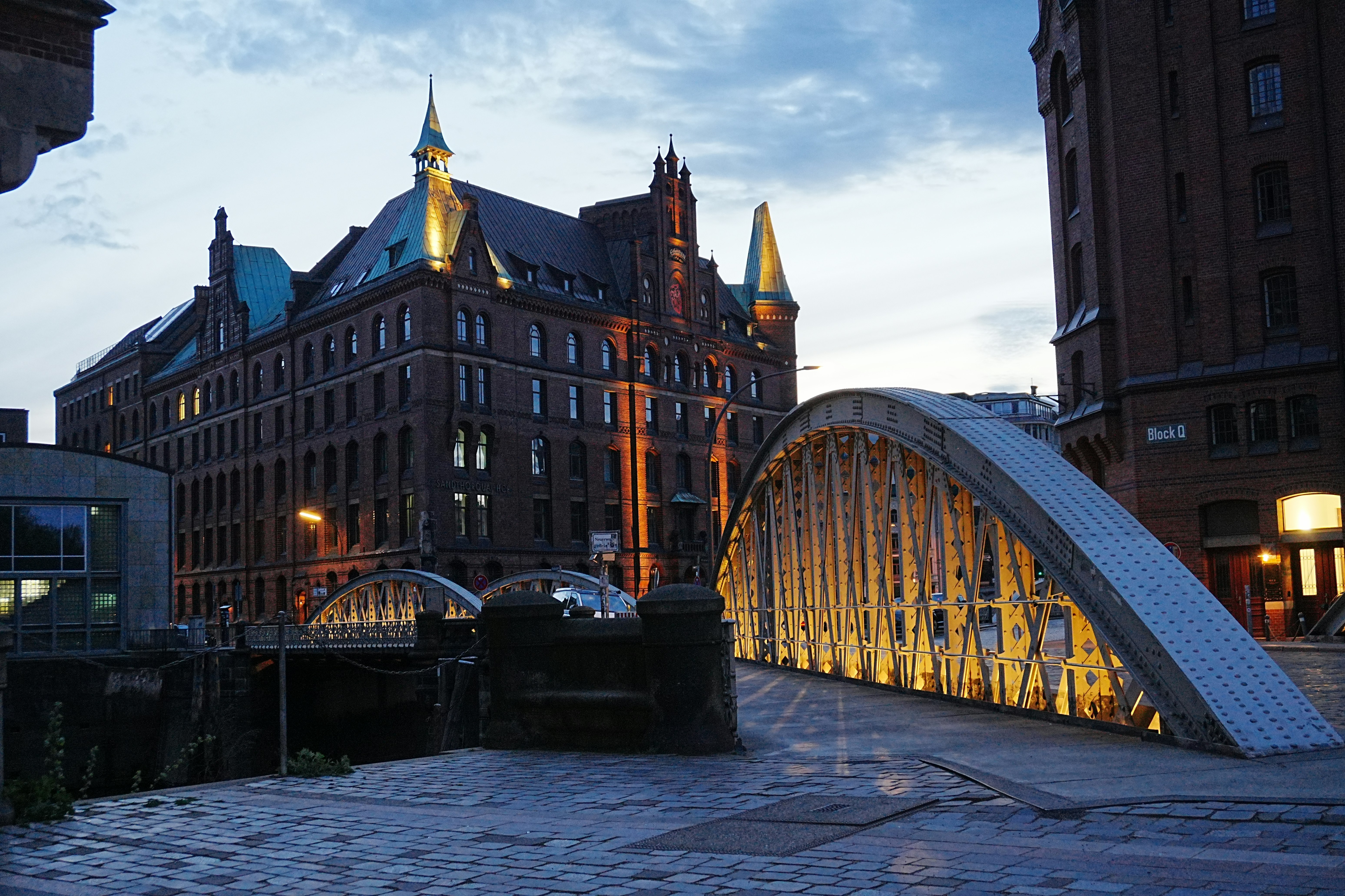 Evening Lights on the Arch: A Gothic Canal Bridge