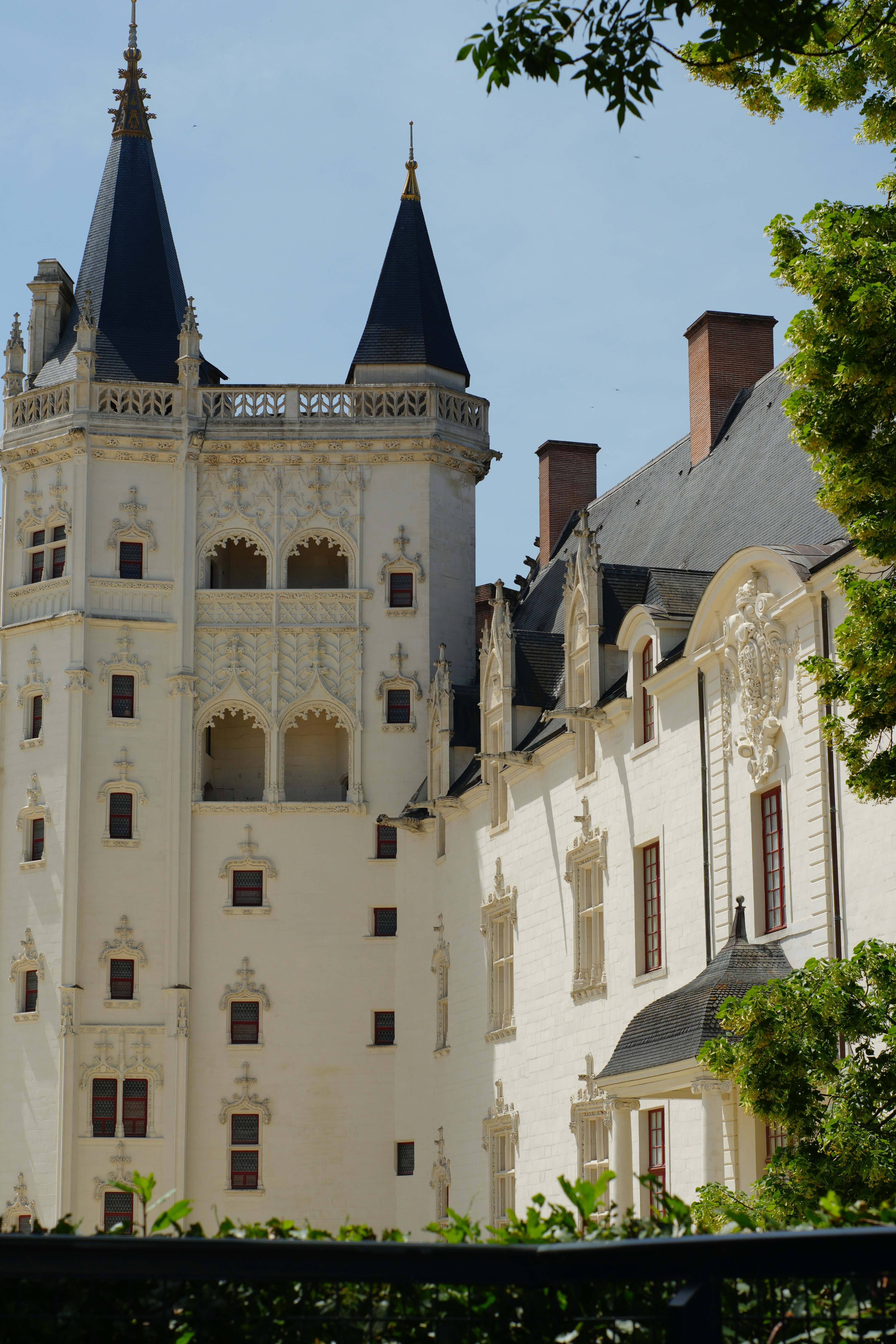 Gothic Turrets and Sunlit Facade of a European Chateau