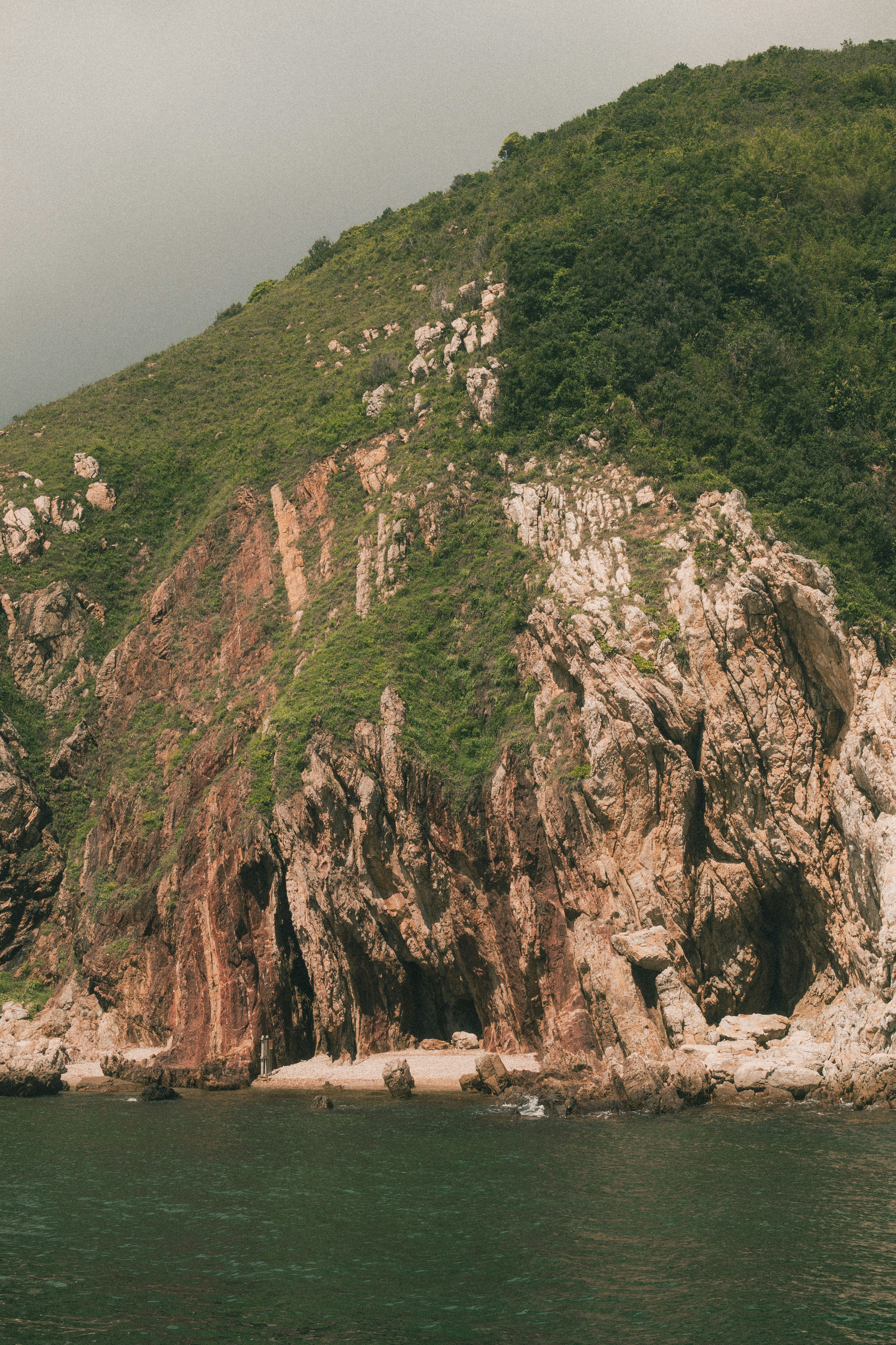 Cliffside Green Veil over Quiet waters